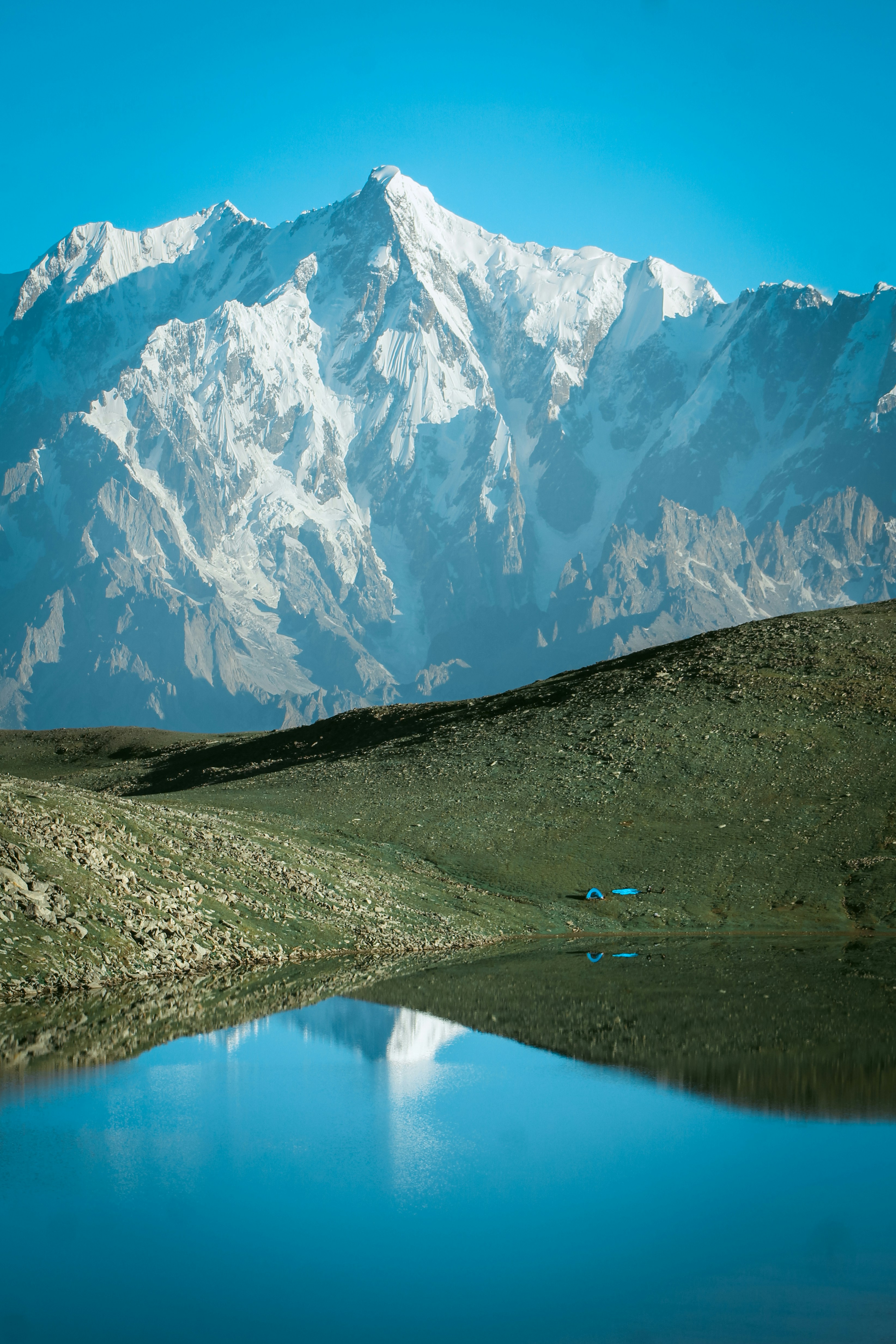 Blue Peak Reflections: Alpine Ridge Under a Cerulean Sky