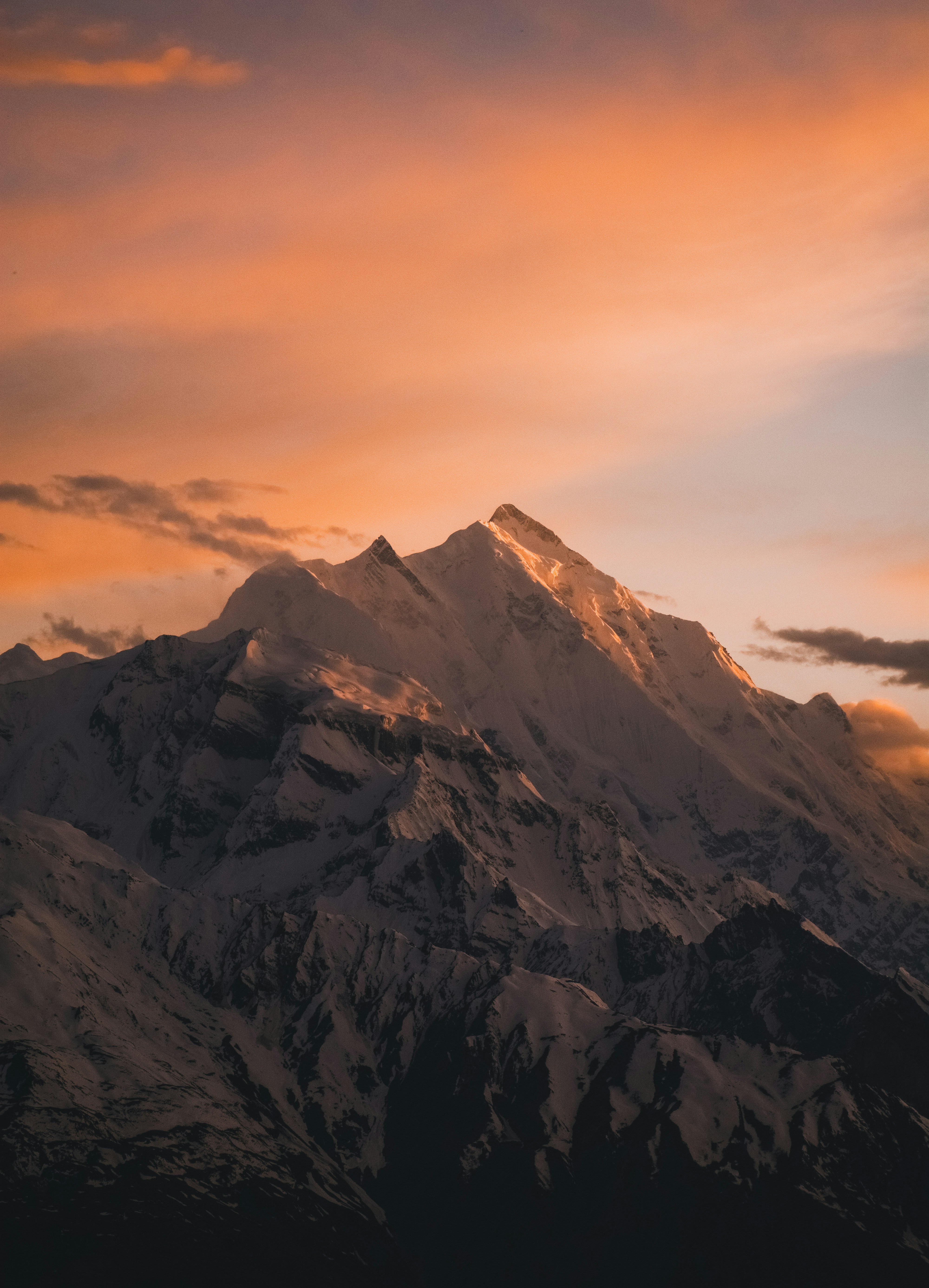 Sunlit Summit: Fire in the Sky Over a Snowbound Peak