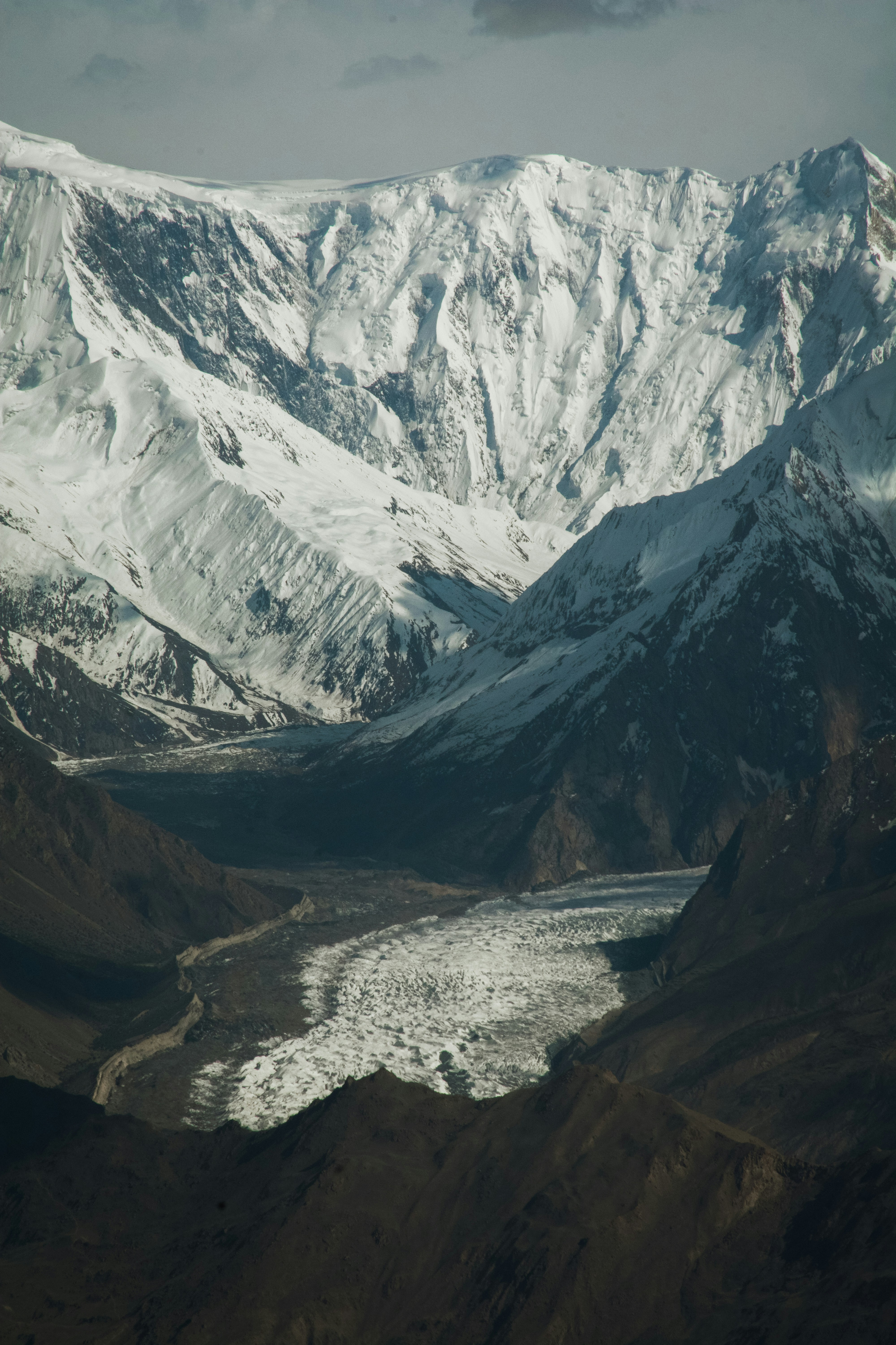 Glacial Corridor Between Snow-clad Peaks