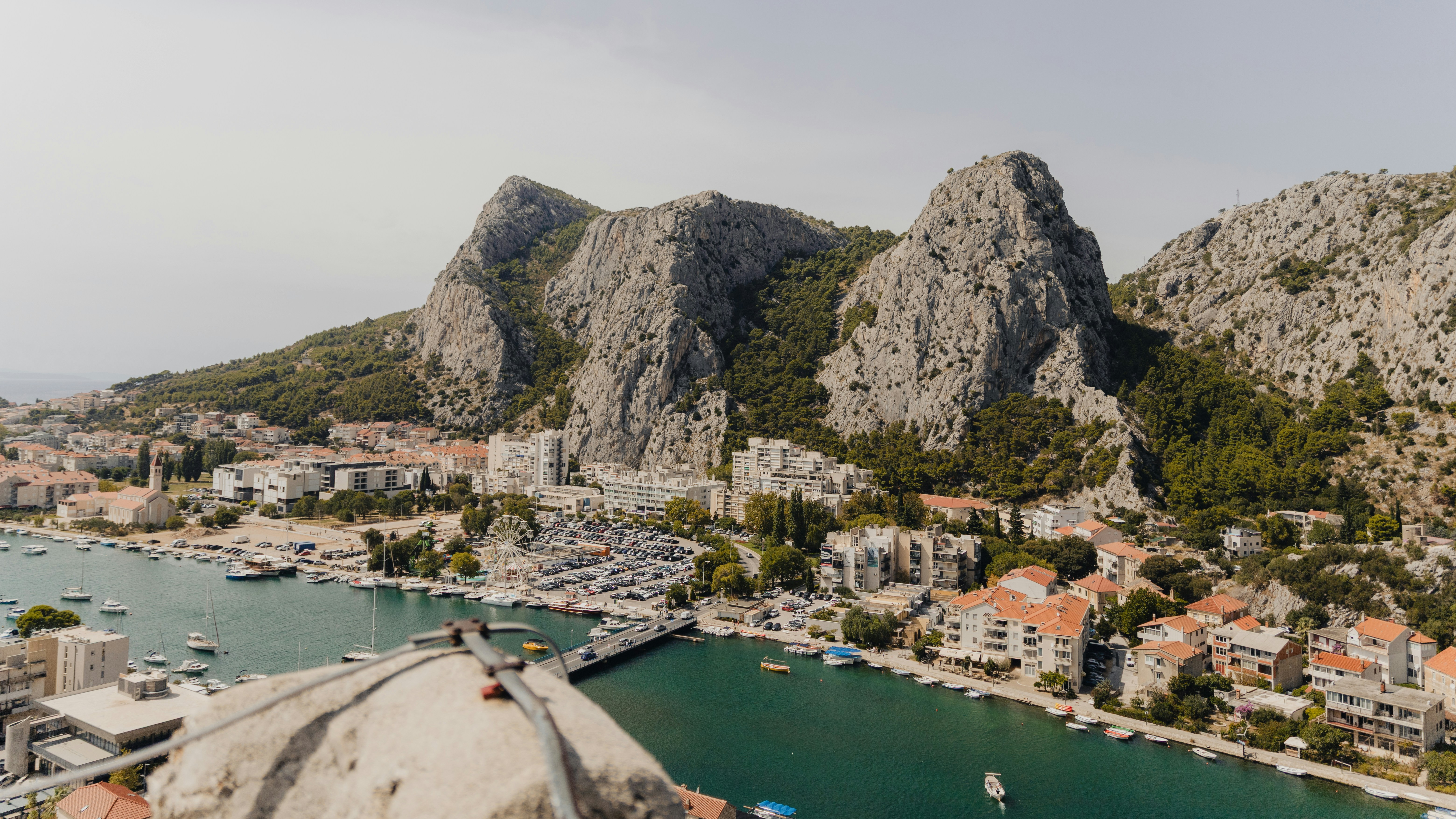 Harbor Village Emerges Between Rugged Carvas peaks