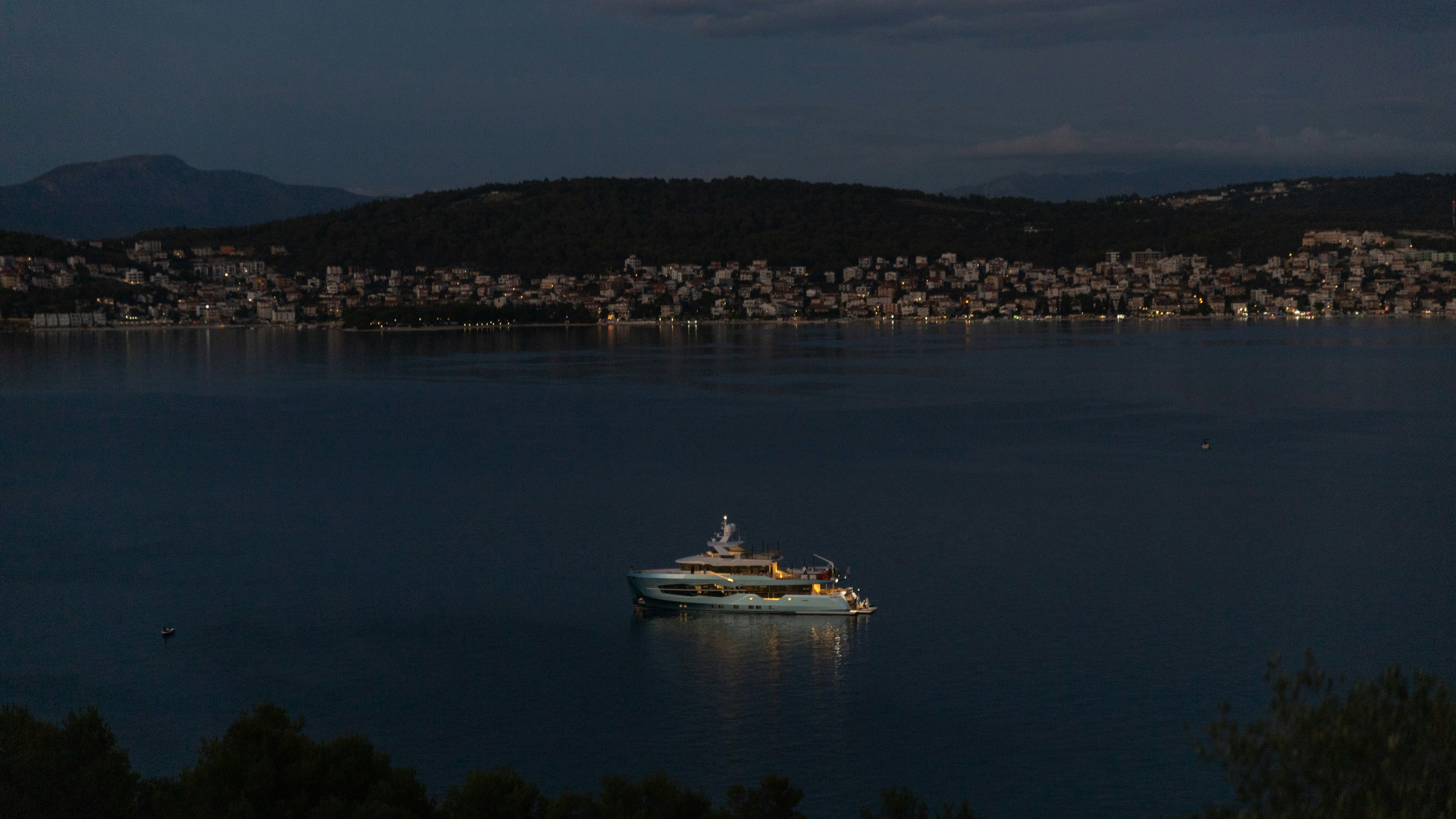 Sailing Vessel in a Quiet Bay at Dusk