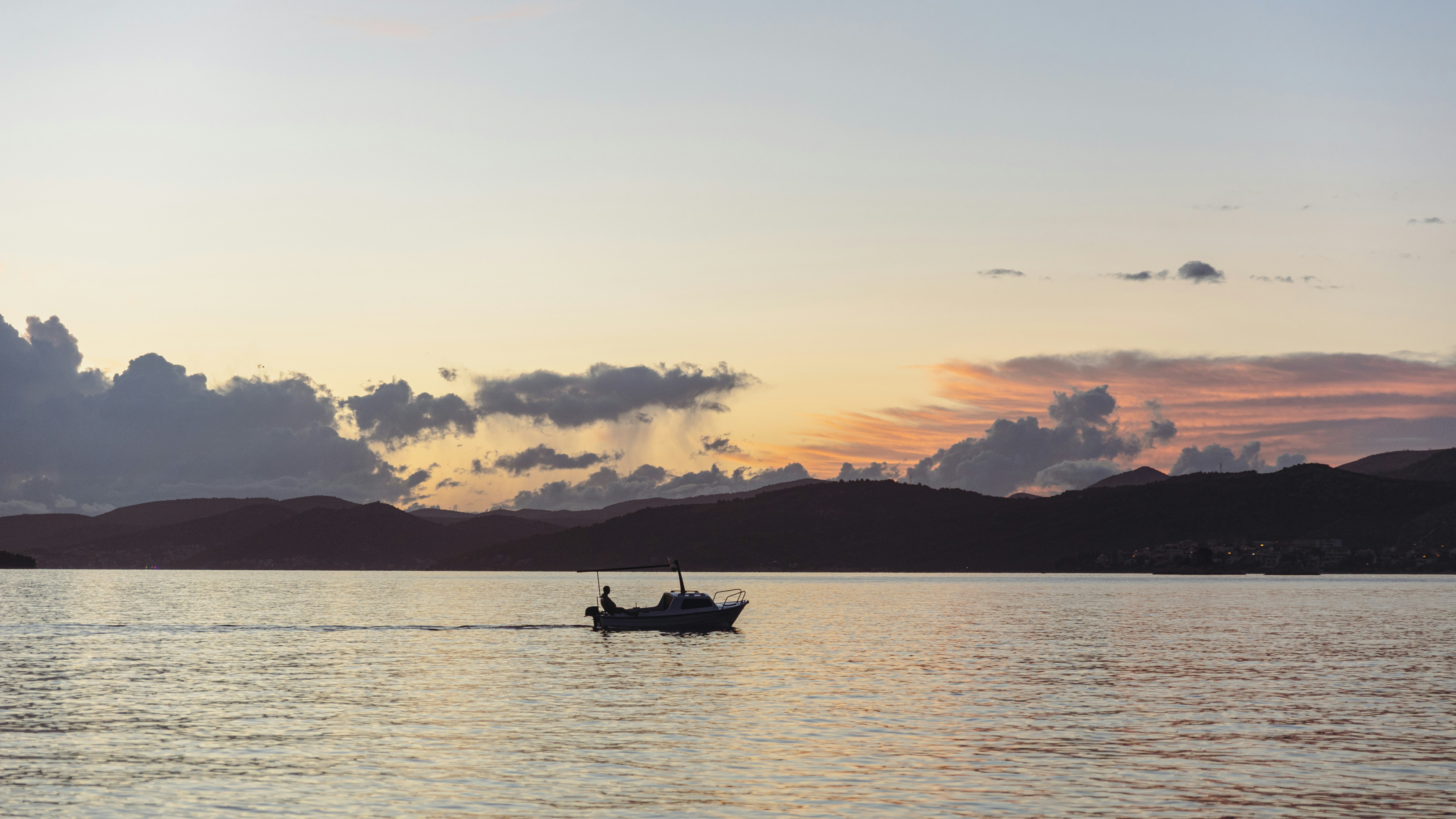 Quiet Boat at Sunset: A Liminal Moment on Calm Waters