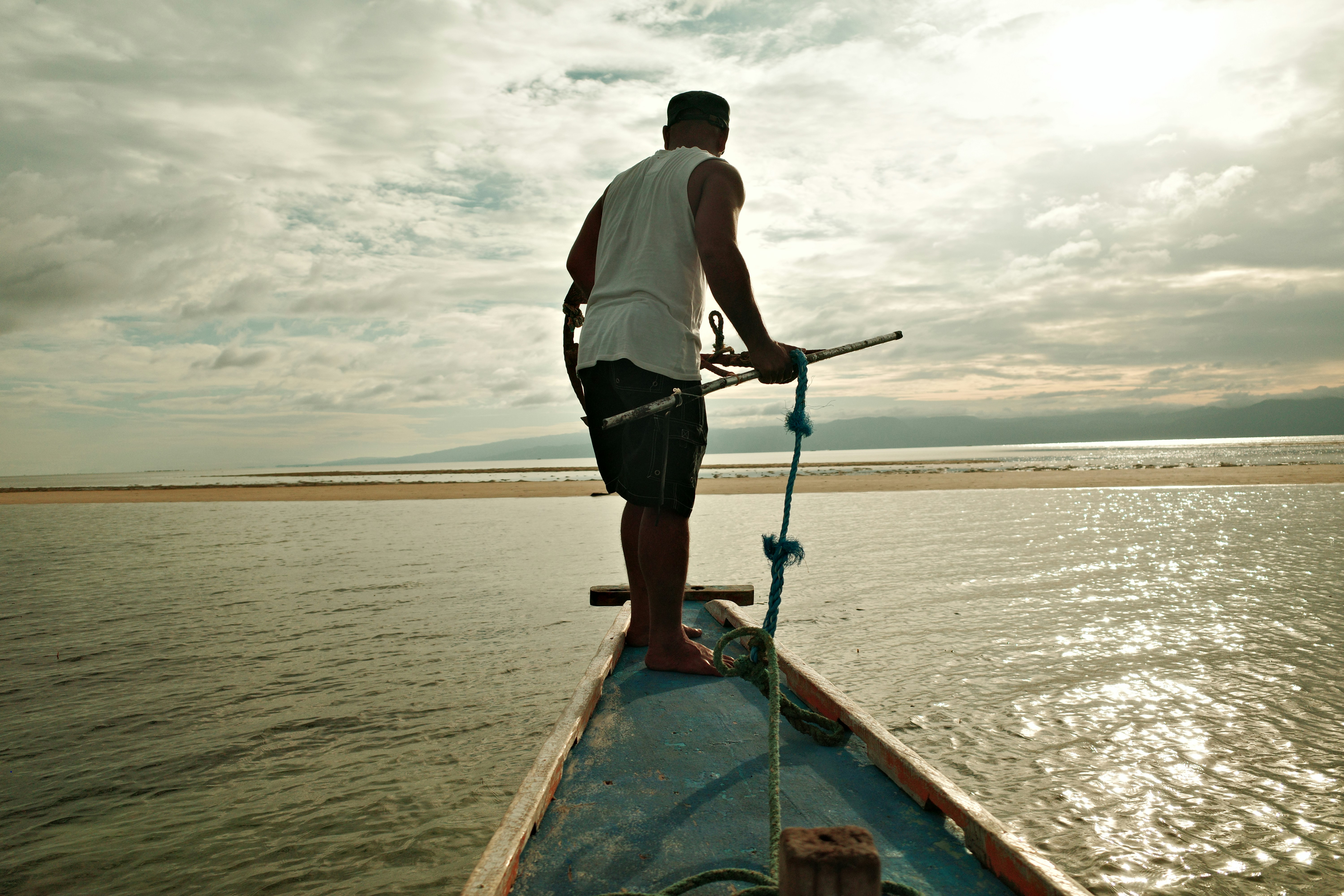 Bow into the Horizon: A Fisherman Guides the Dawn