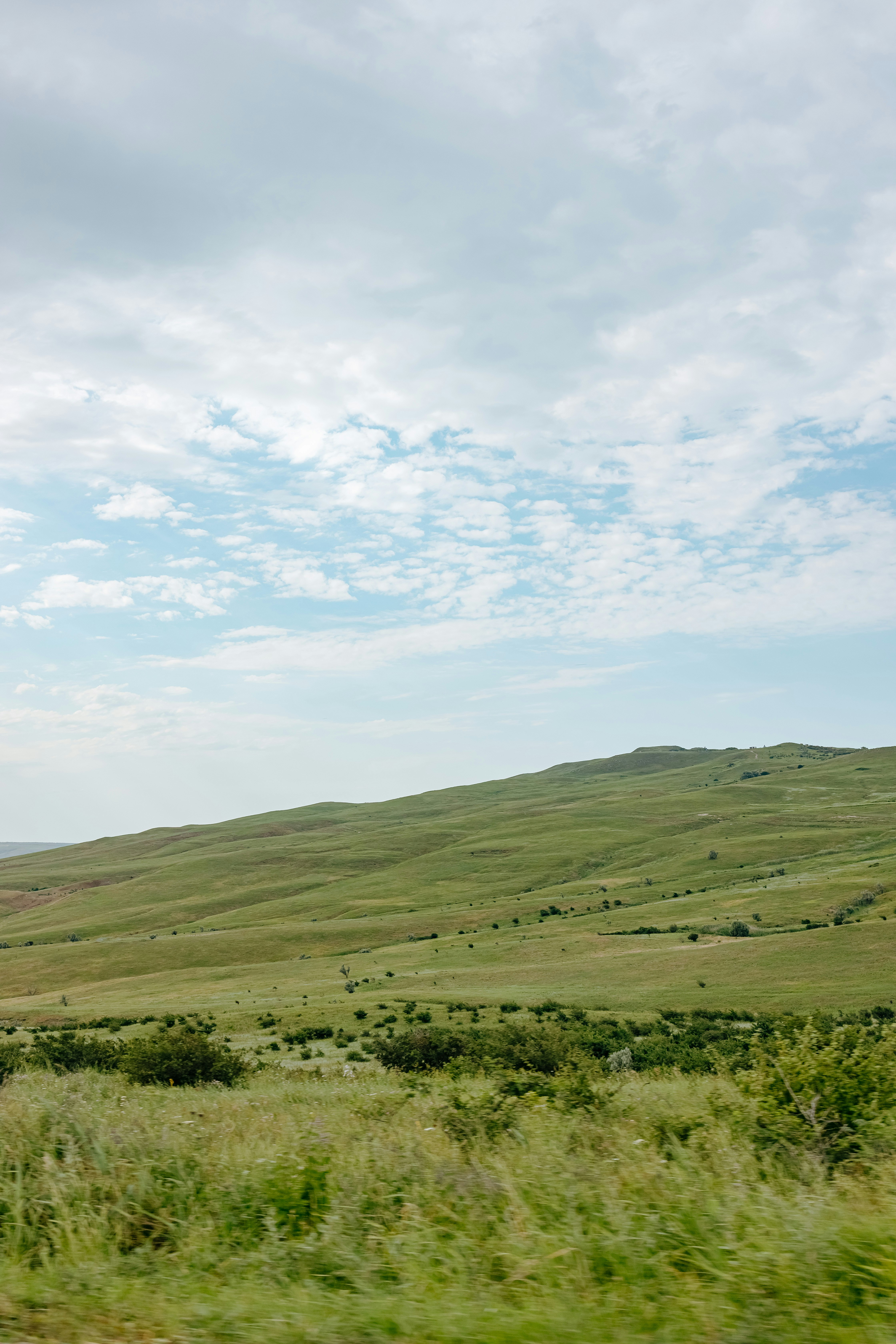 Rolling Hills Under a Patchwork Sky