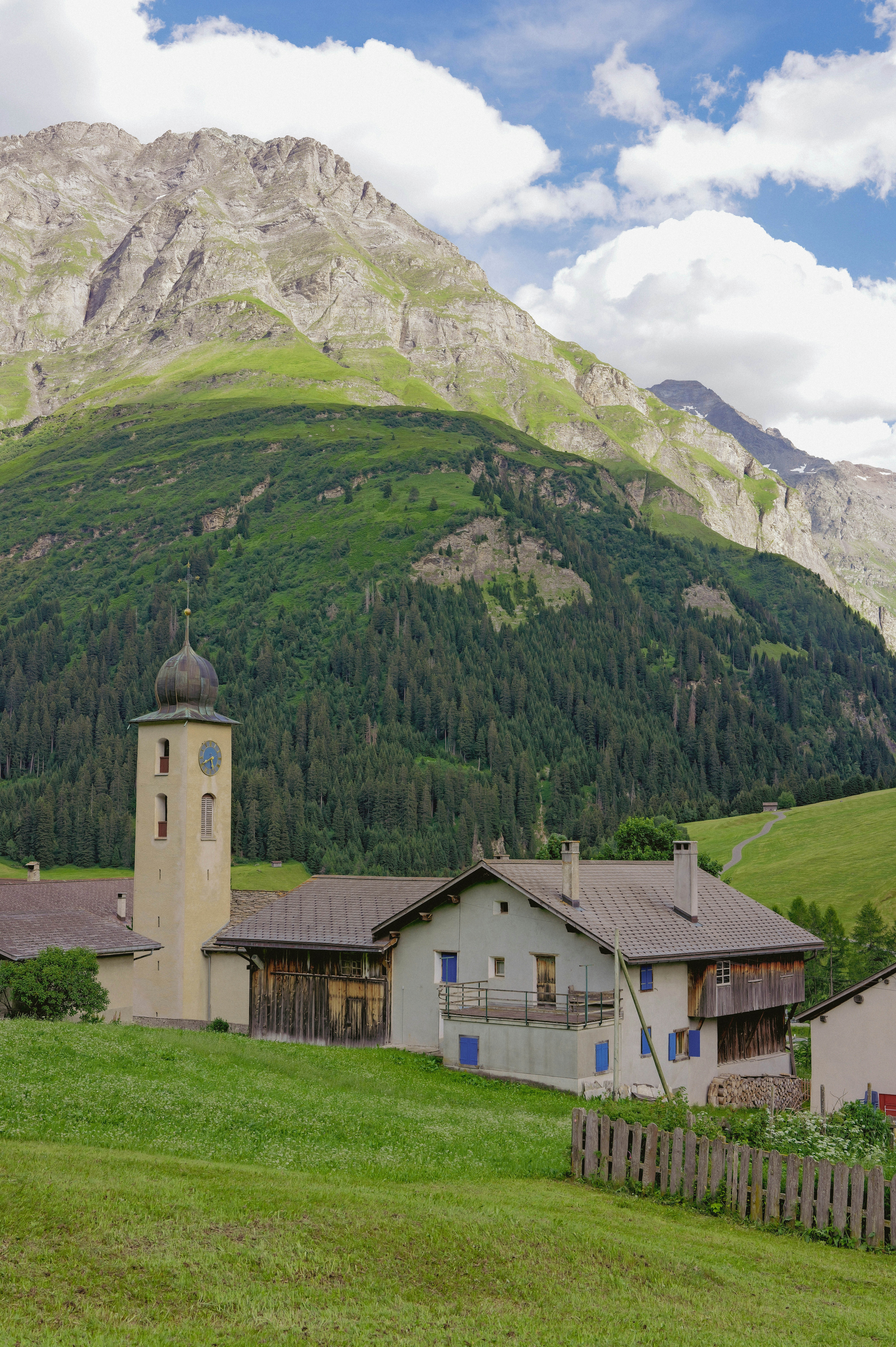 Alpine Village Nestled Against Towering Peaks