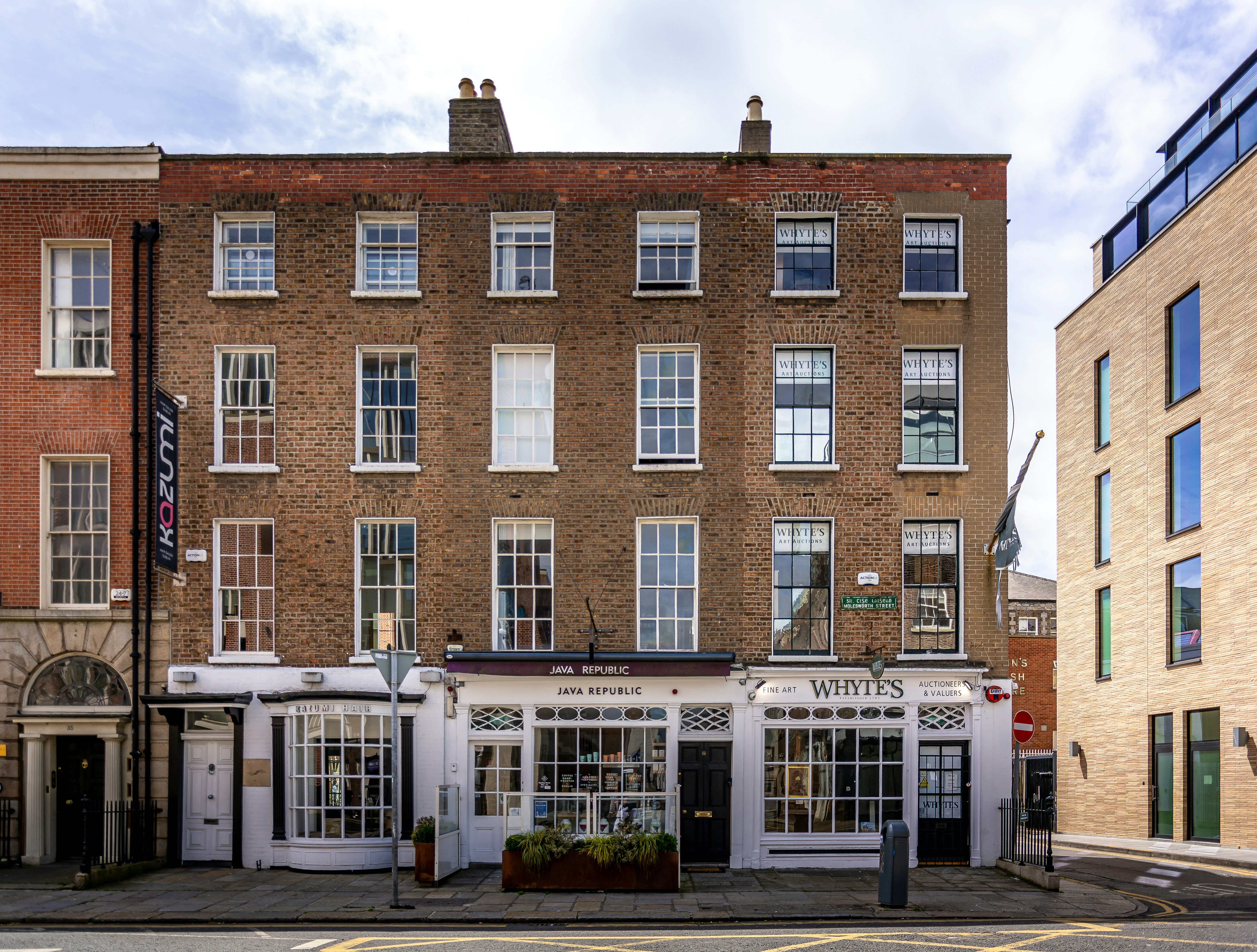 Townhouse Facade Chorus: A Row of Shops and Windows