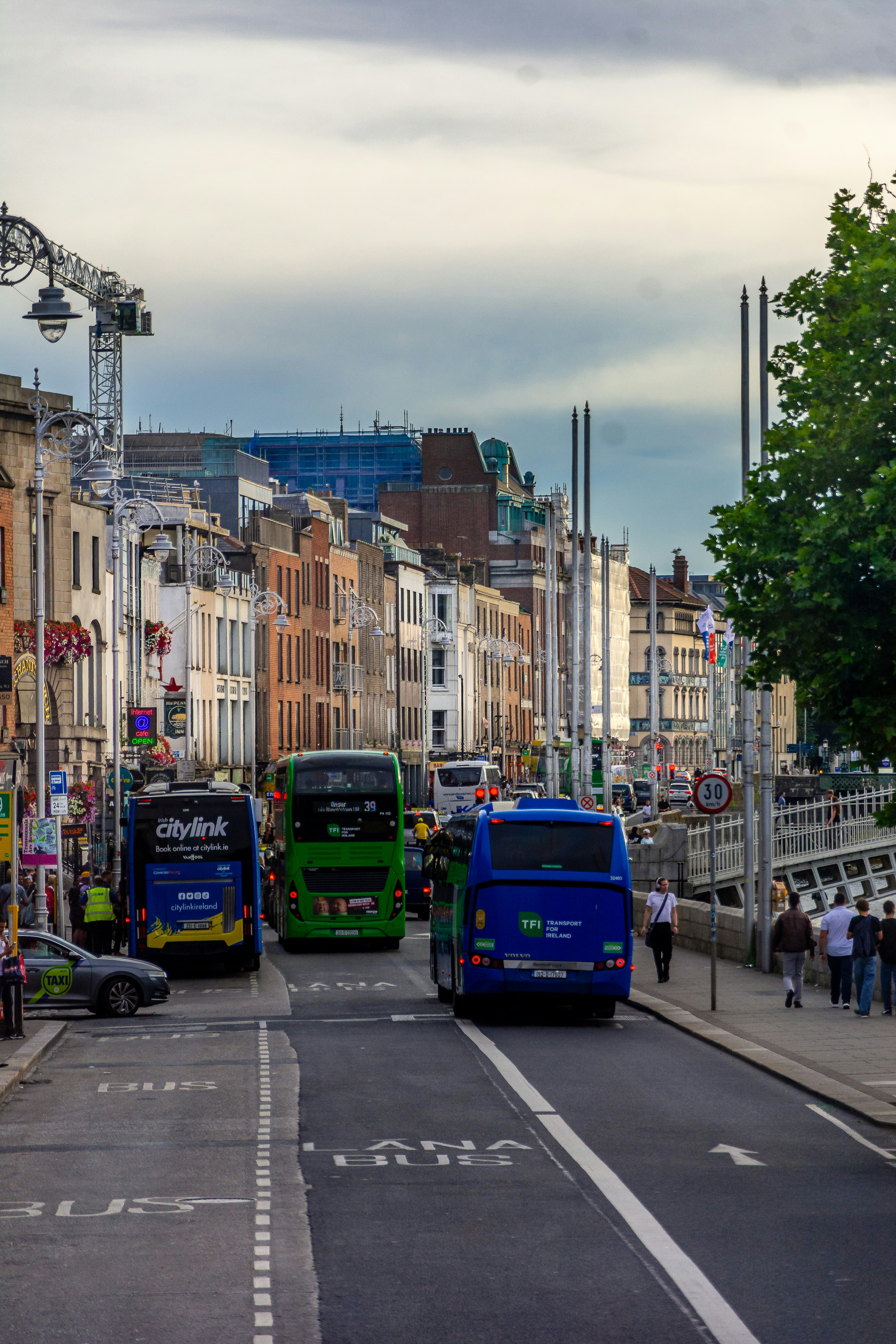 City in Motion: Buses, Streets and People Amid Historic Facades