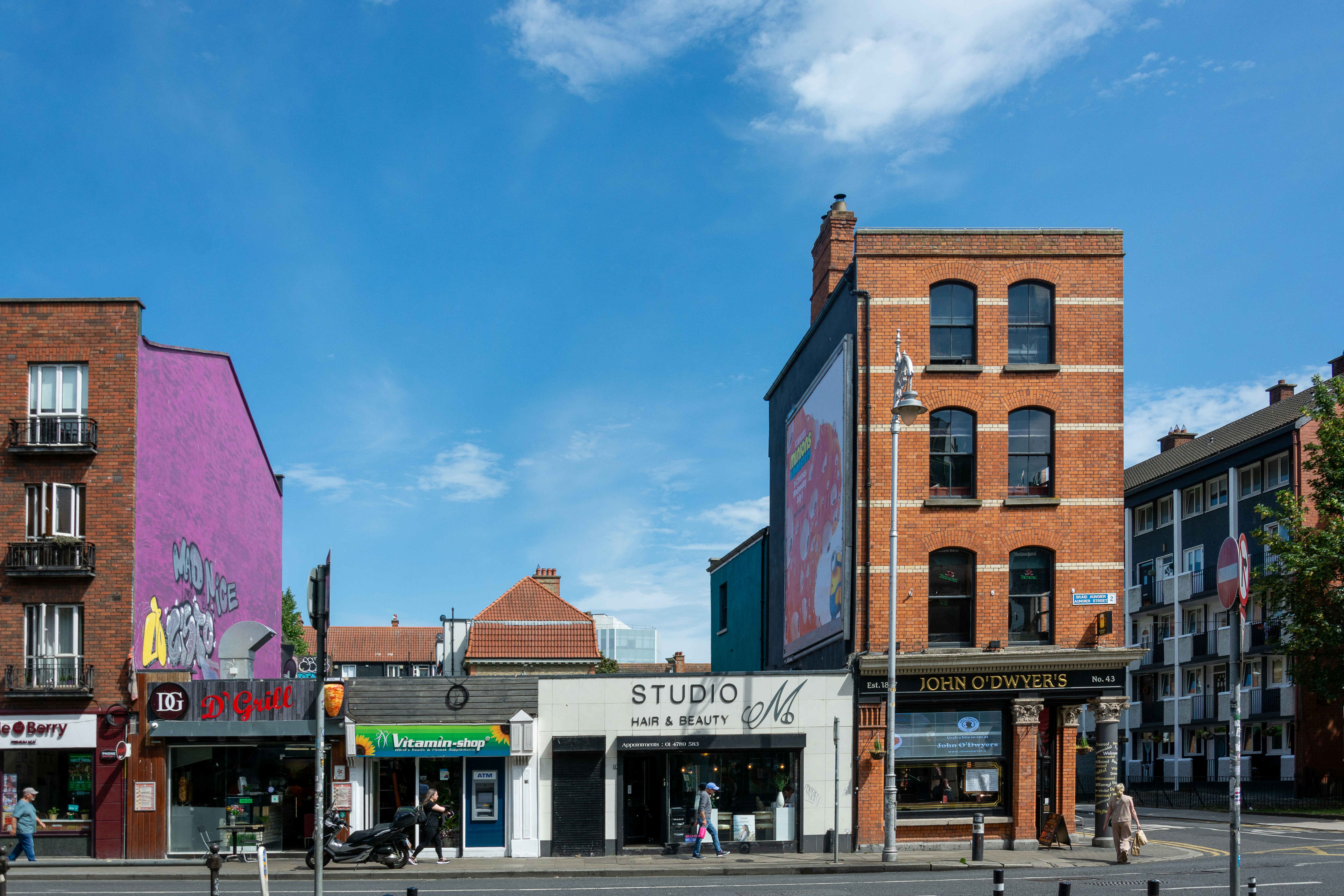 Urban Gallery: A Row of Historic Shops Framed by a Bright Sky