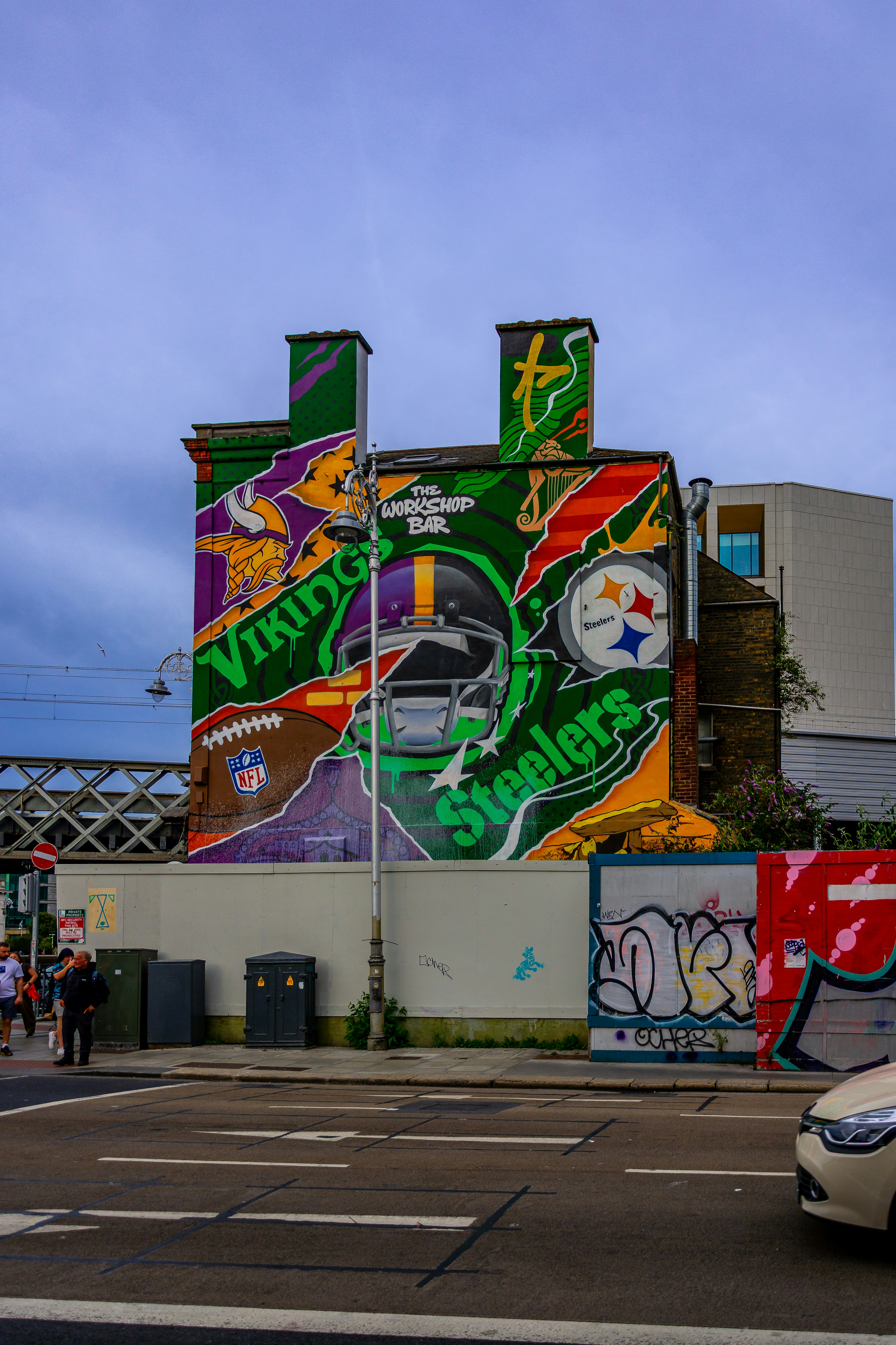 Vibrant Stadium Wall Comes Alive at an Urban Junction