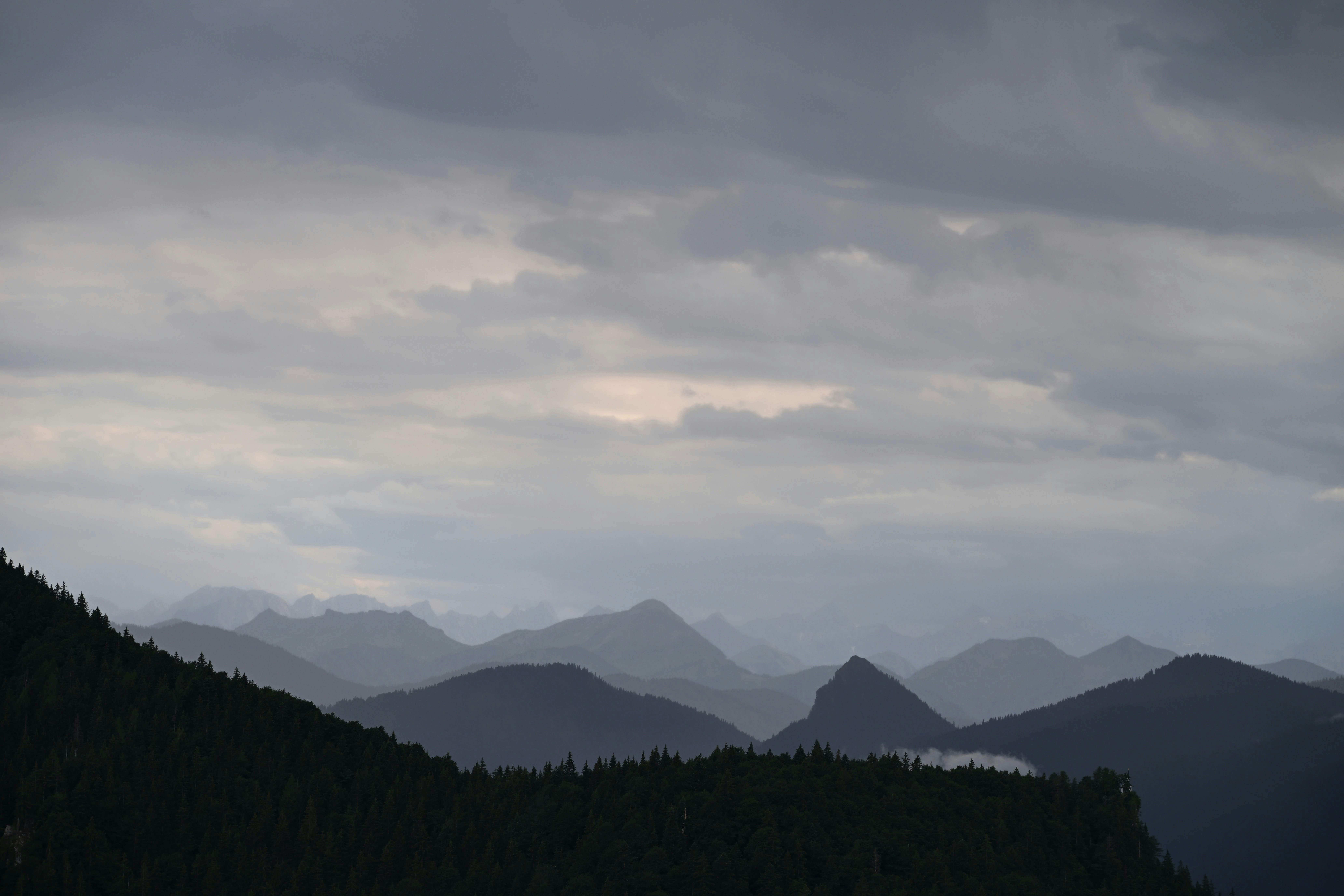Silhouetted Ridge under Layered Mountain Mist