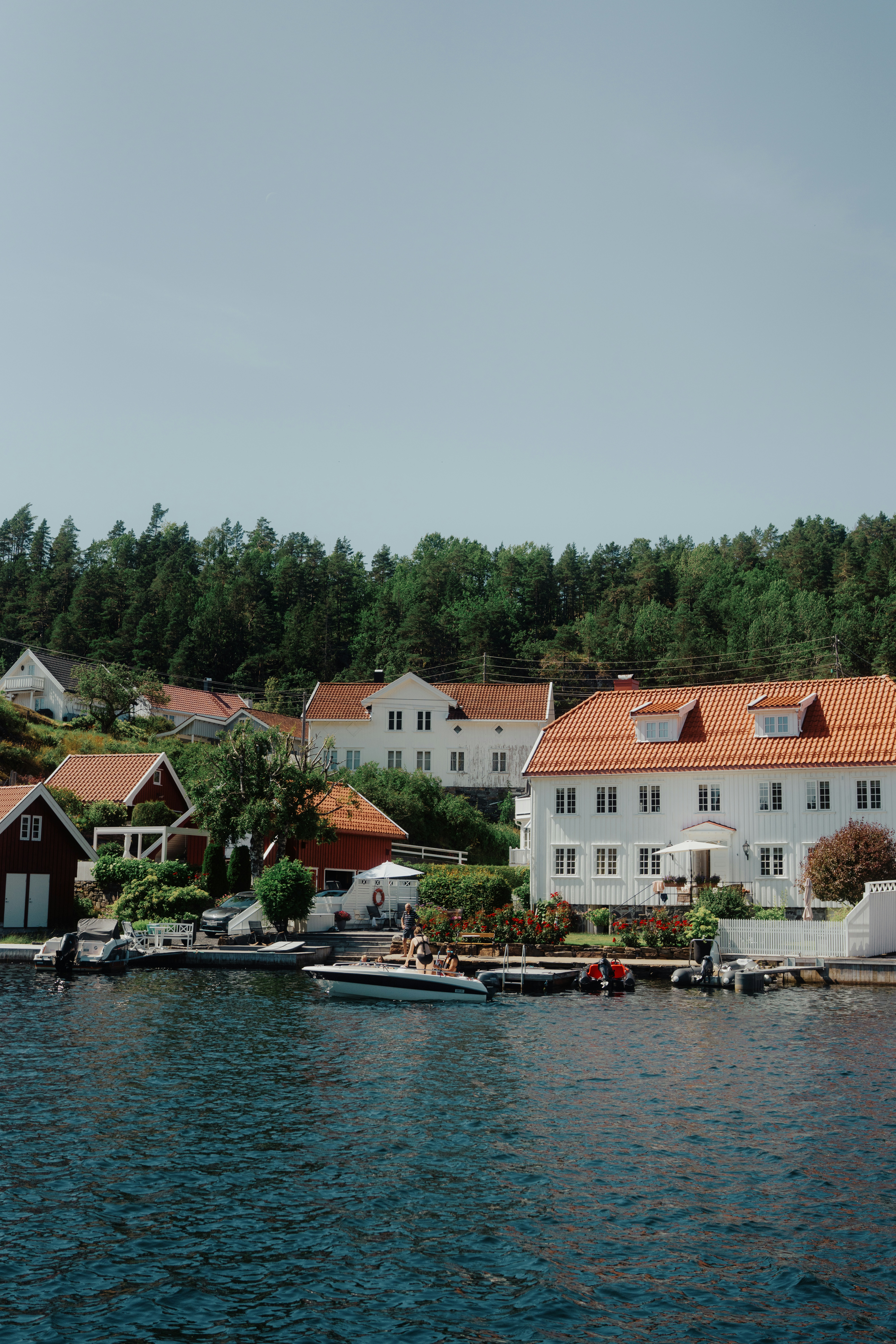 Harbor Village at Dusk: Quiet Boats and Red-Tiled Roofs by the Waterfront