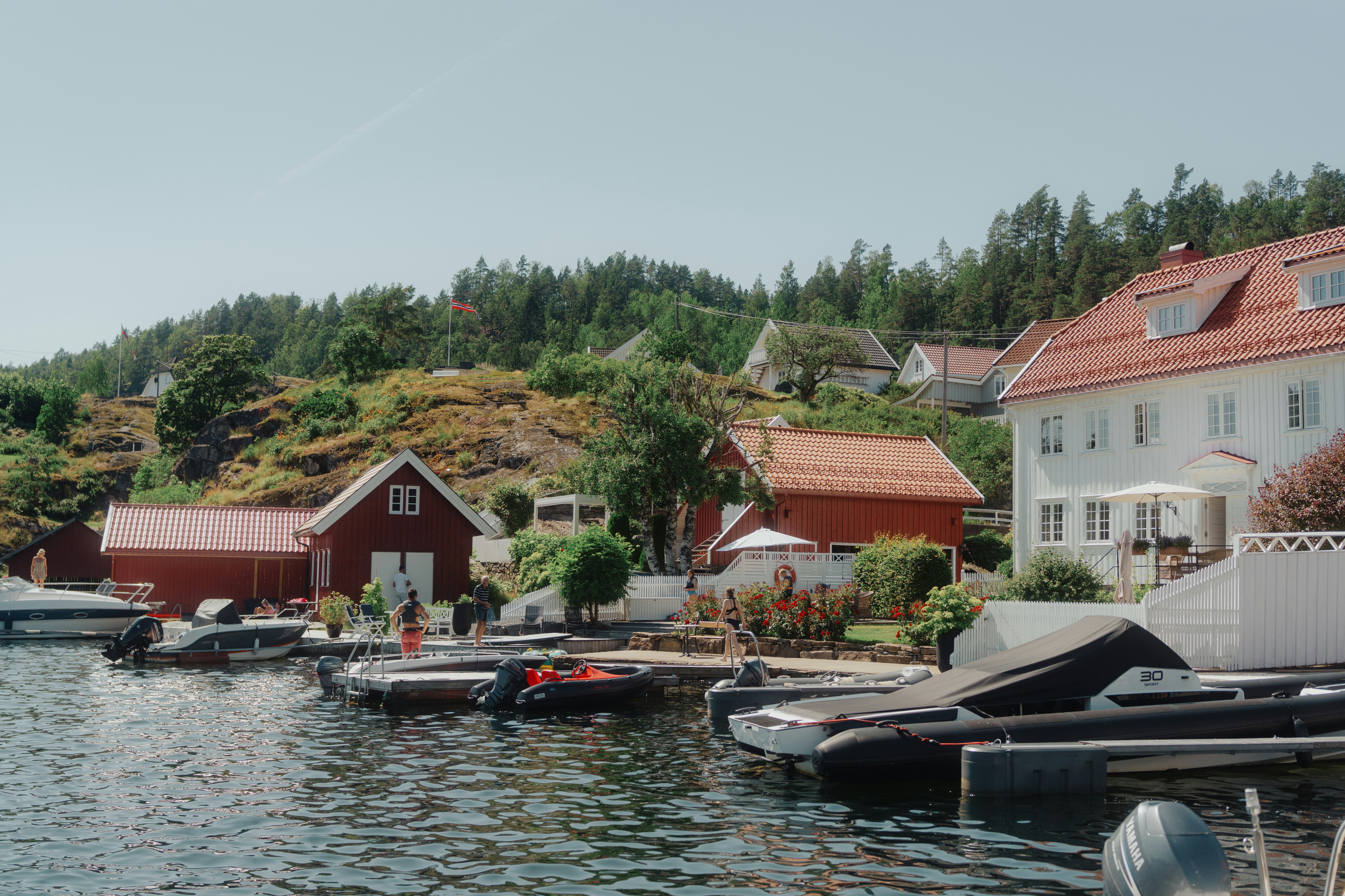 Harbor Village: Boats,idyllic quay, and sunlit cottages