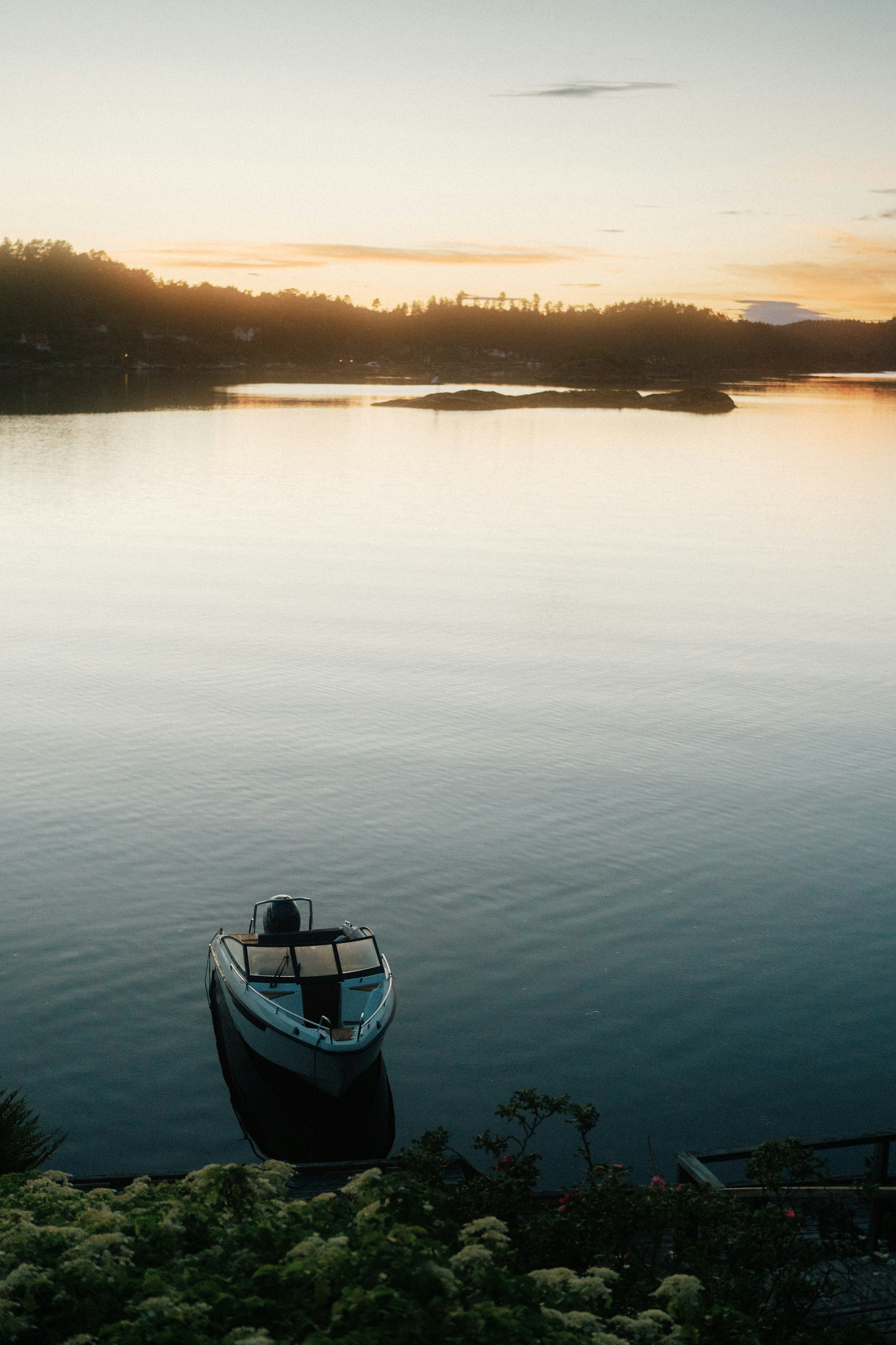 Moonlit Docks: A Lone Boat Resting on Quiet Waters