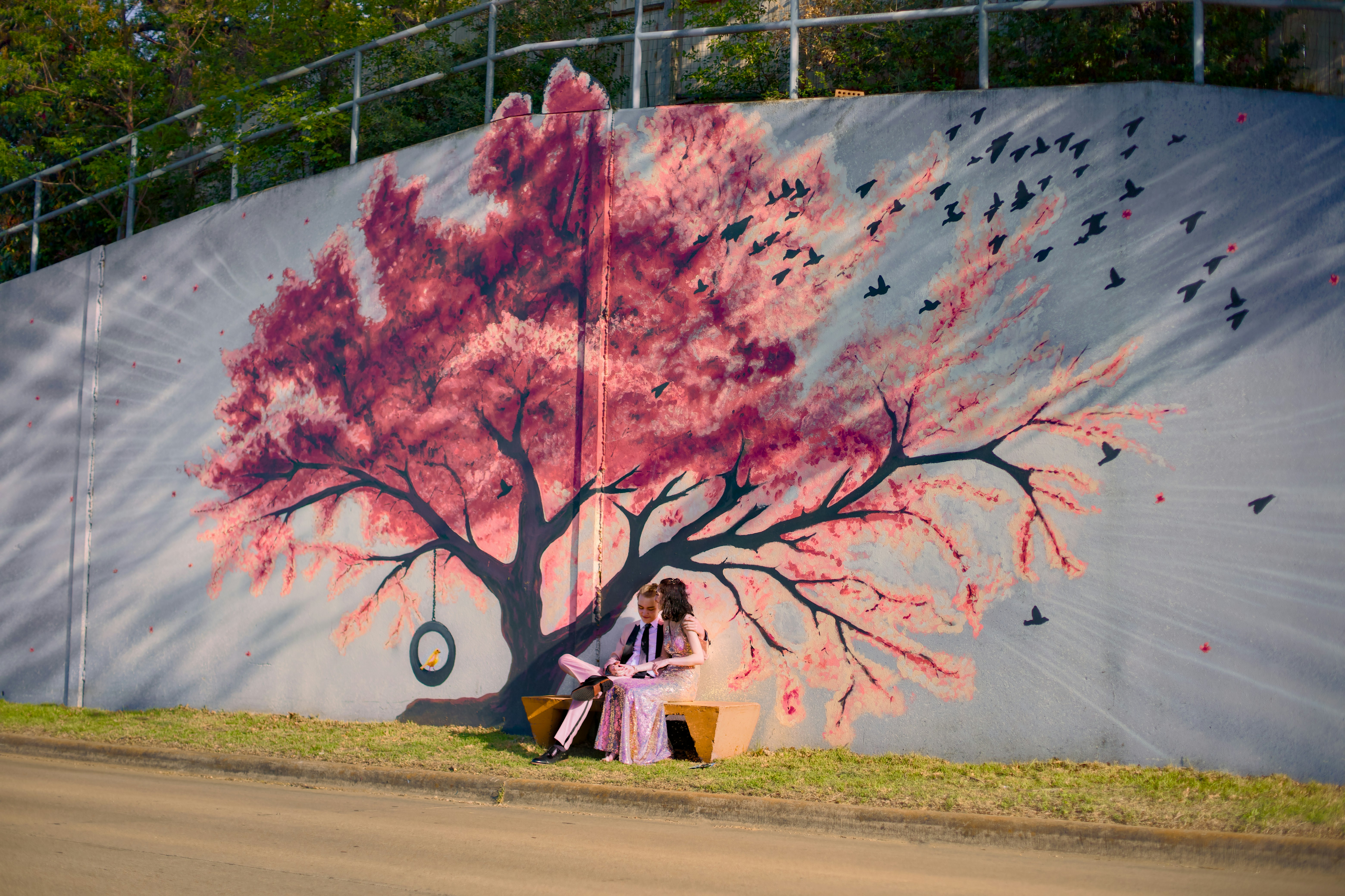 Portrait by the Painted Tree: A Couple Beneath a Blossoming Mural
