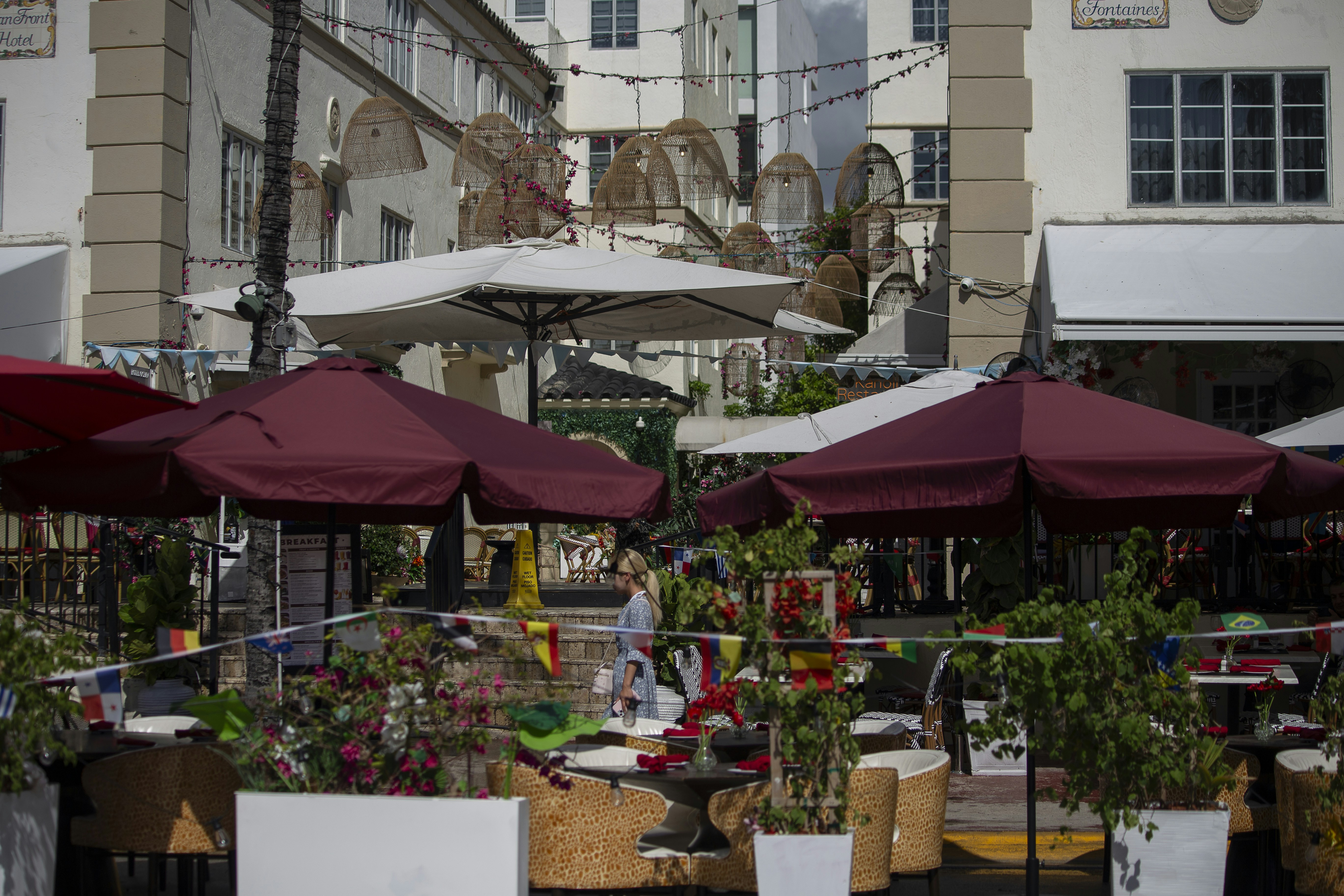 Al Fresco Courtyard: Floral Canopy Under Crimson Parasols