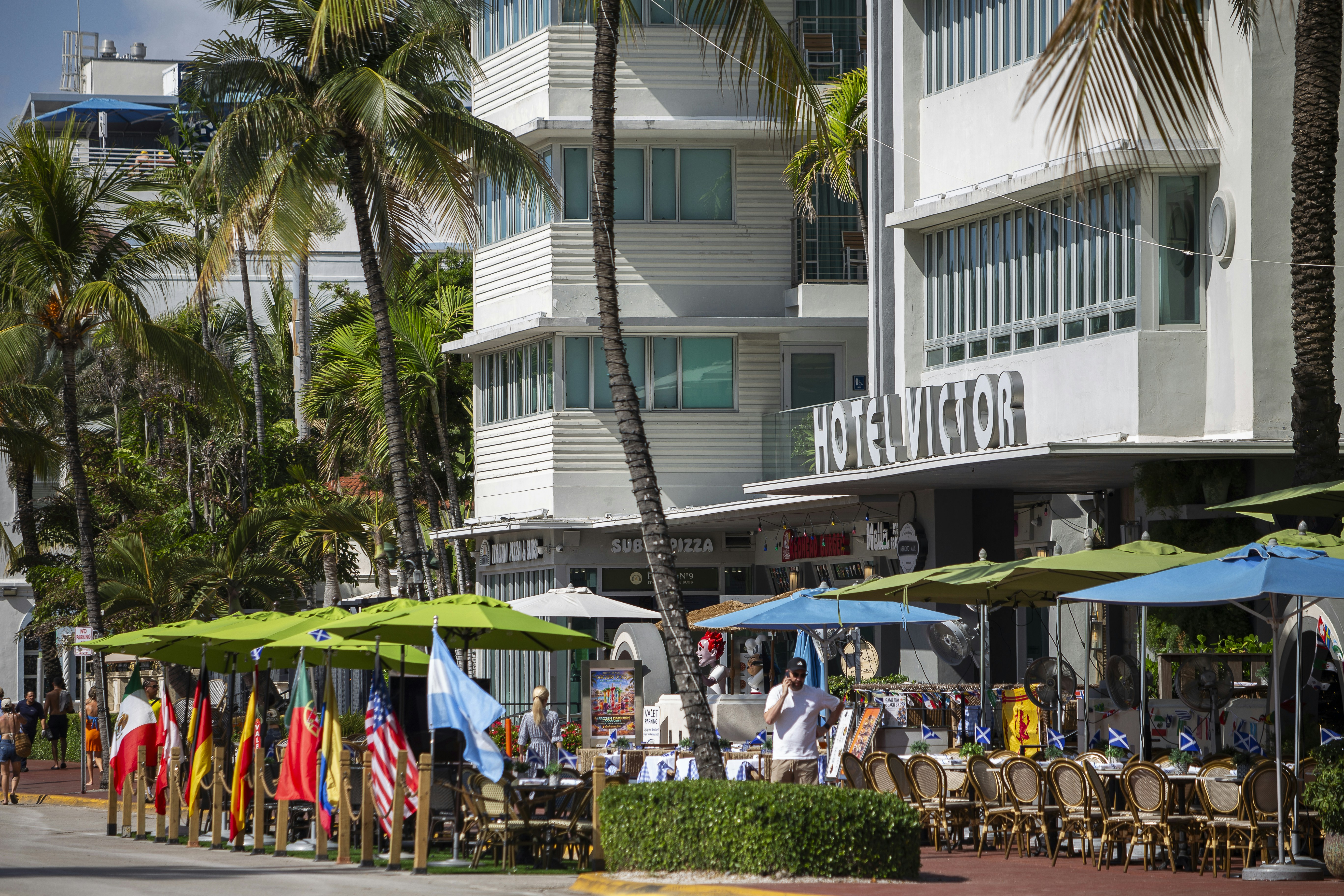 Sunlit Oceanfront Café Corridor with Colorful Umbrellas