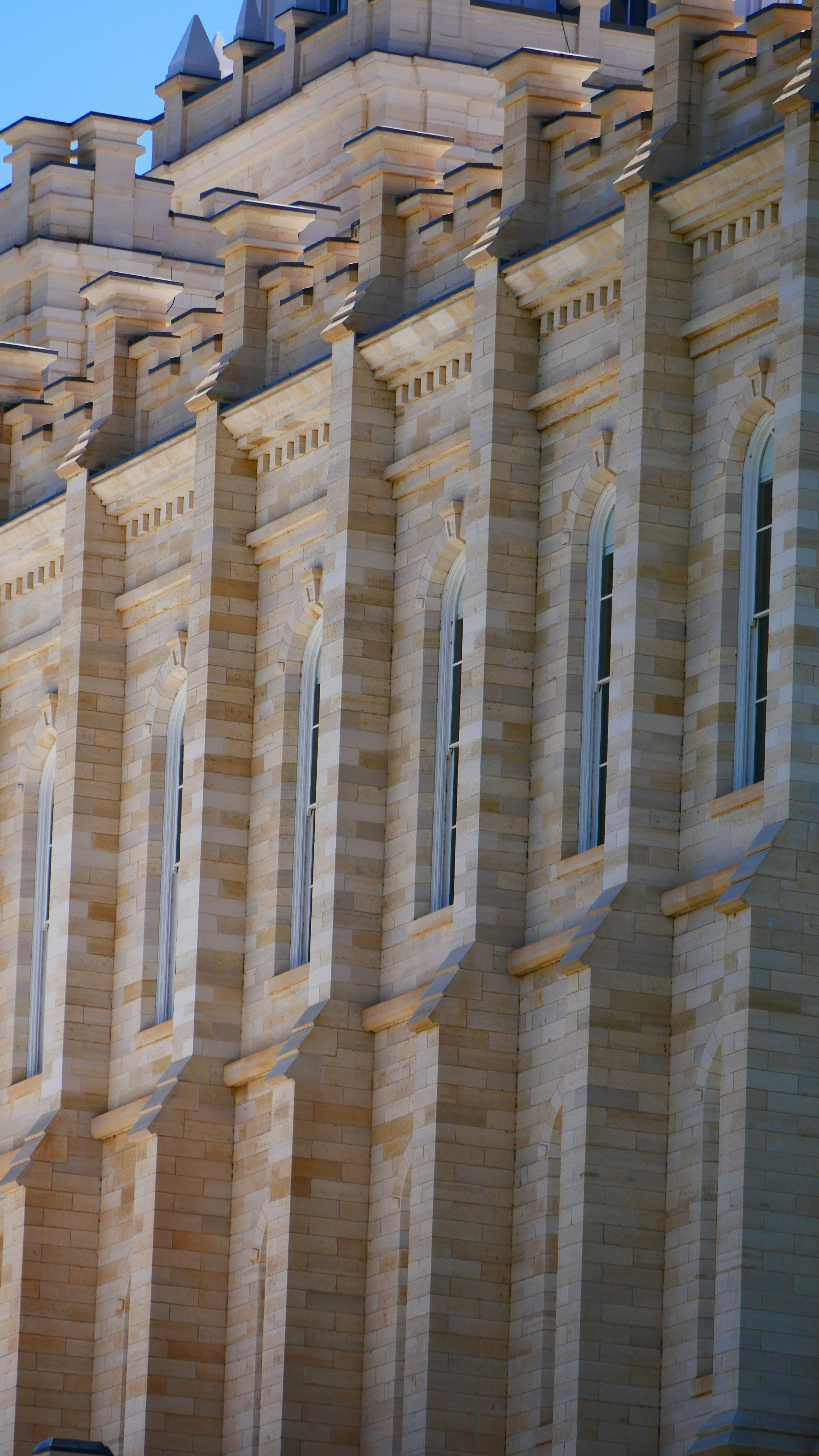 Ashlar Harmony: Vertical Arches in Sunlit Brickwork