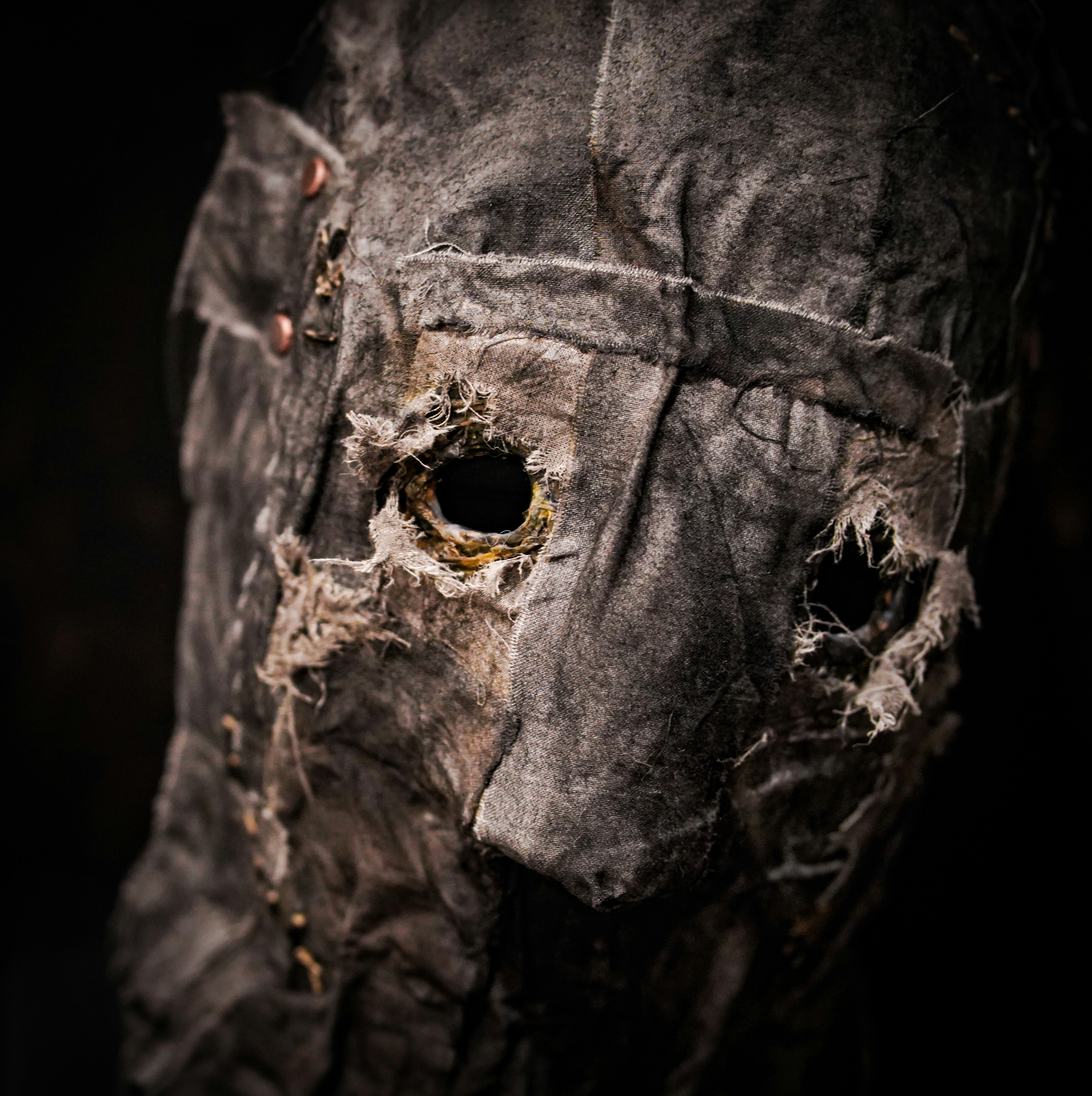 Tattered Veil of Darkness: A Mask of Decay