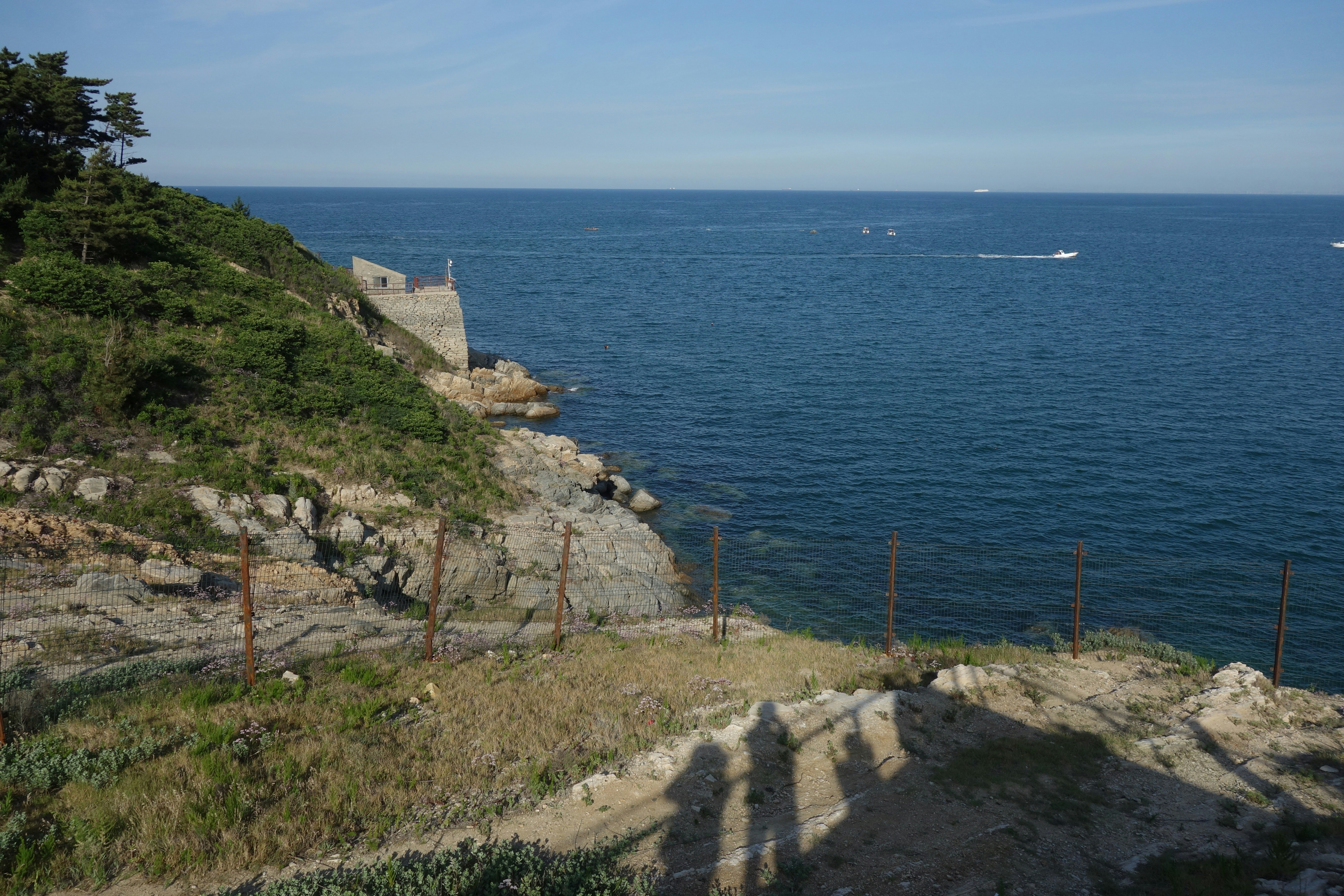 Clifftop Horizon: Castle Ramparts Mediate the Sea