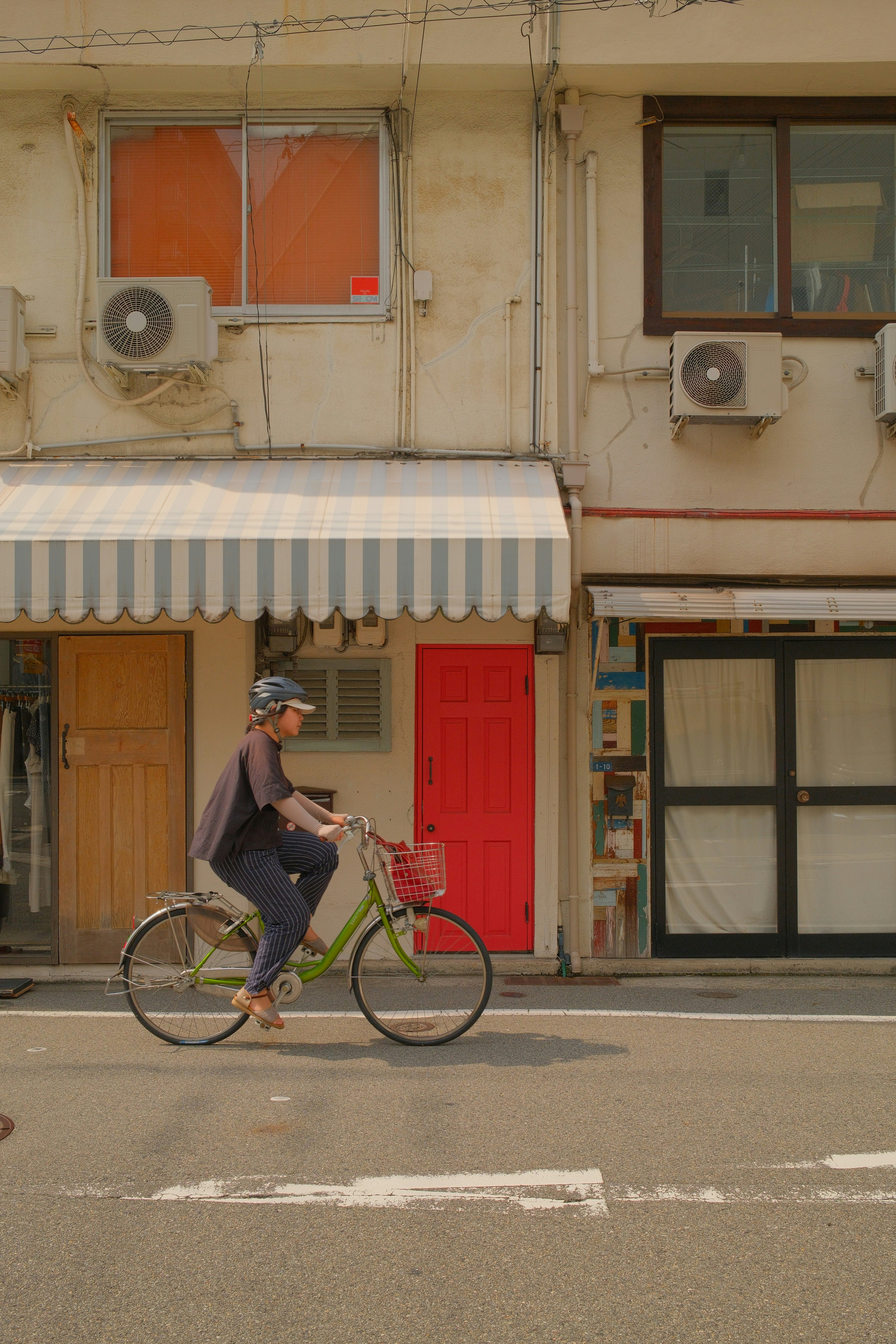 City cyclist with a red doorway heartbeat