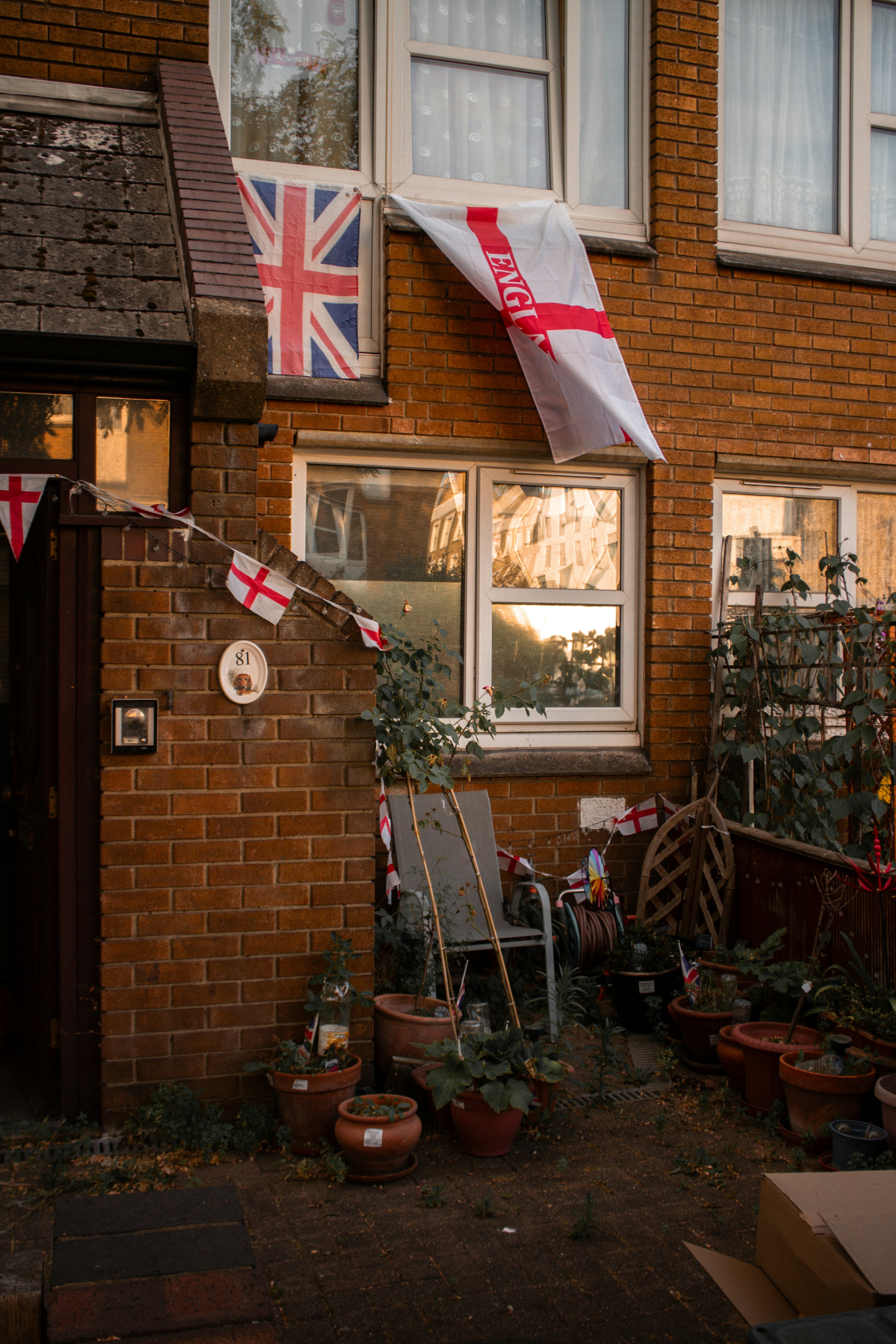 Union Jack and Flag Streamers Framing a Cozy Front Yard