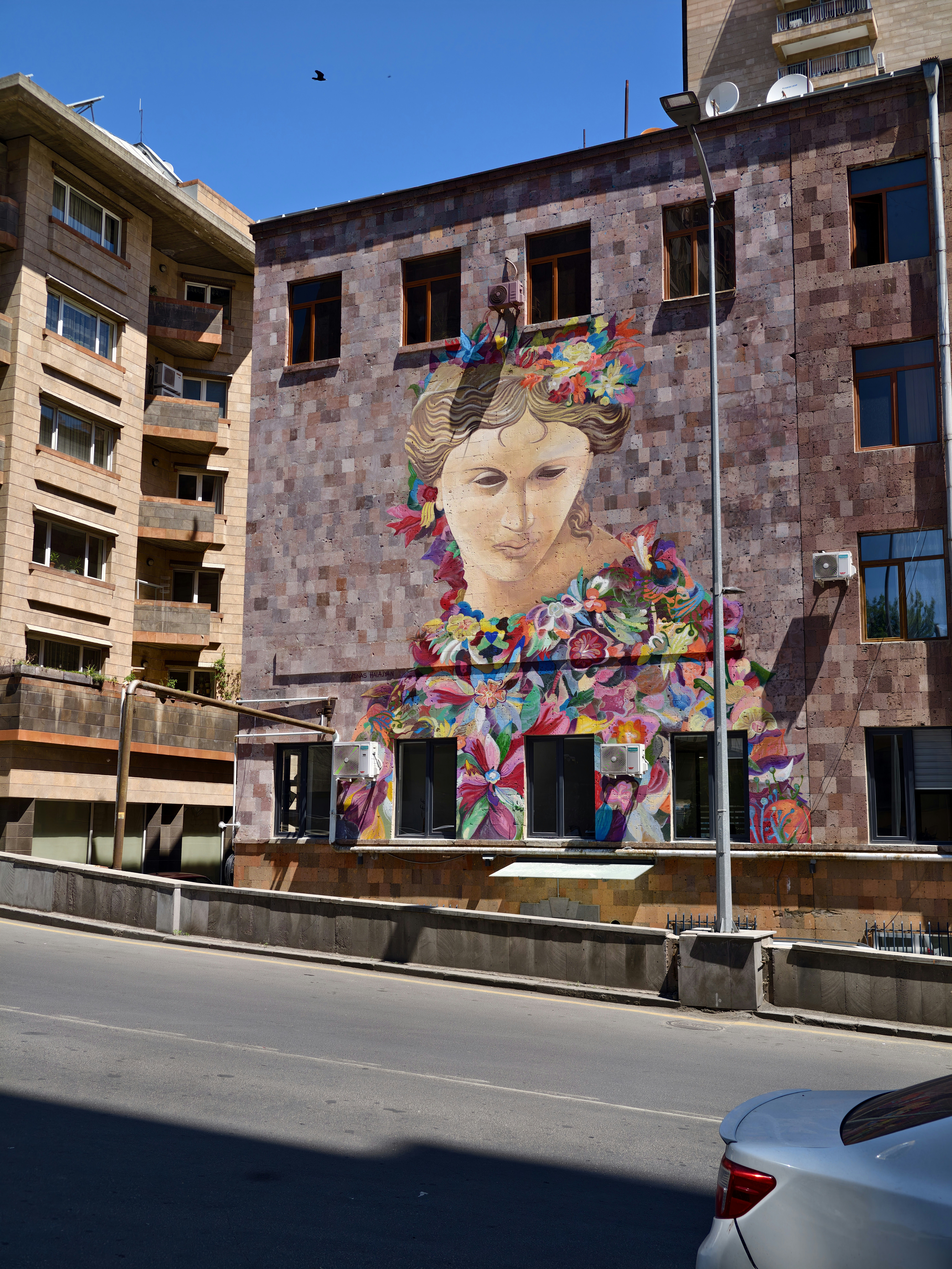 Fresco on Brick: Portrait Murals Elevate a Quiet Street