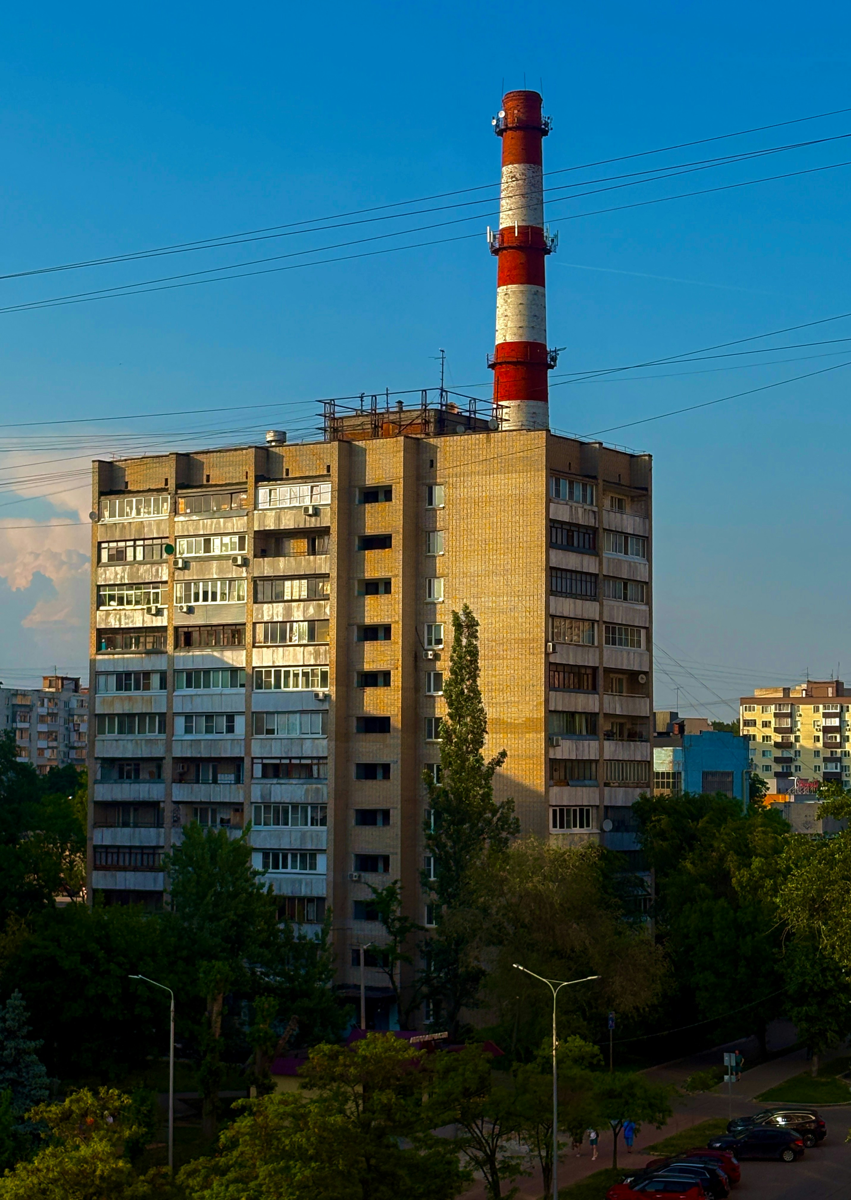 Flare Tower over a Sunlit Panel Block