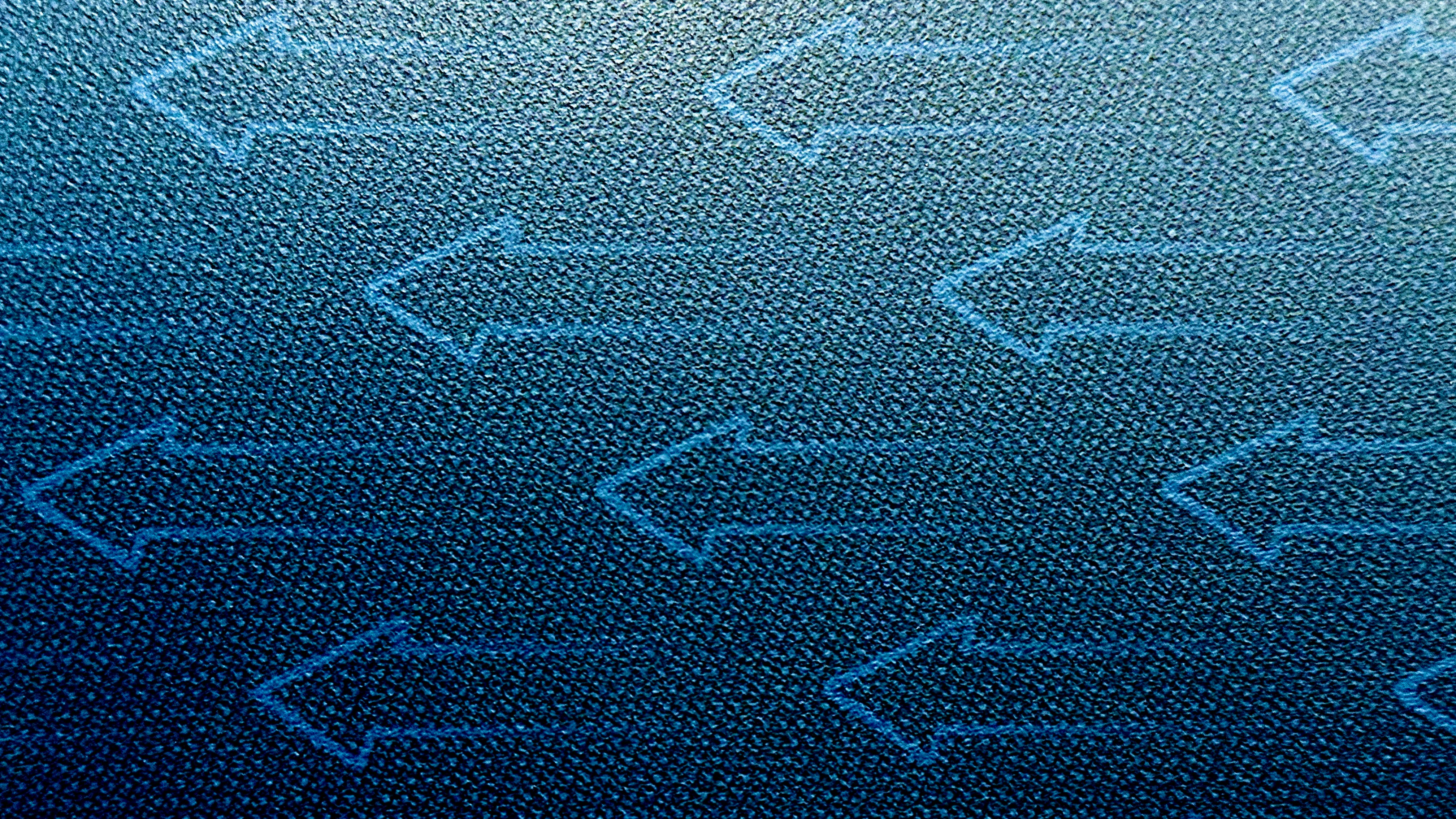 Blue gradient texture with repeating arrow outlines forming a subtle pattern, creating a modern abstract background.