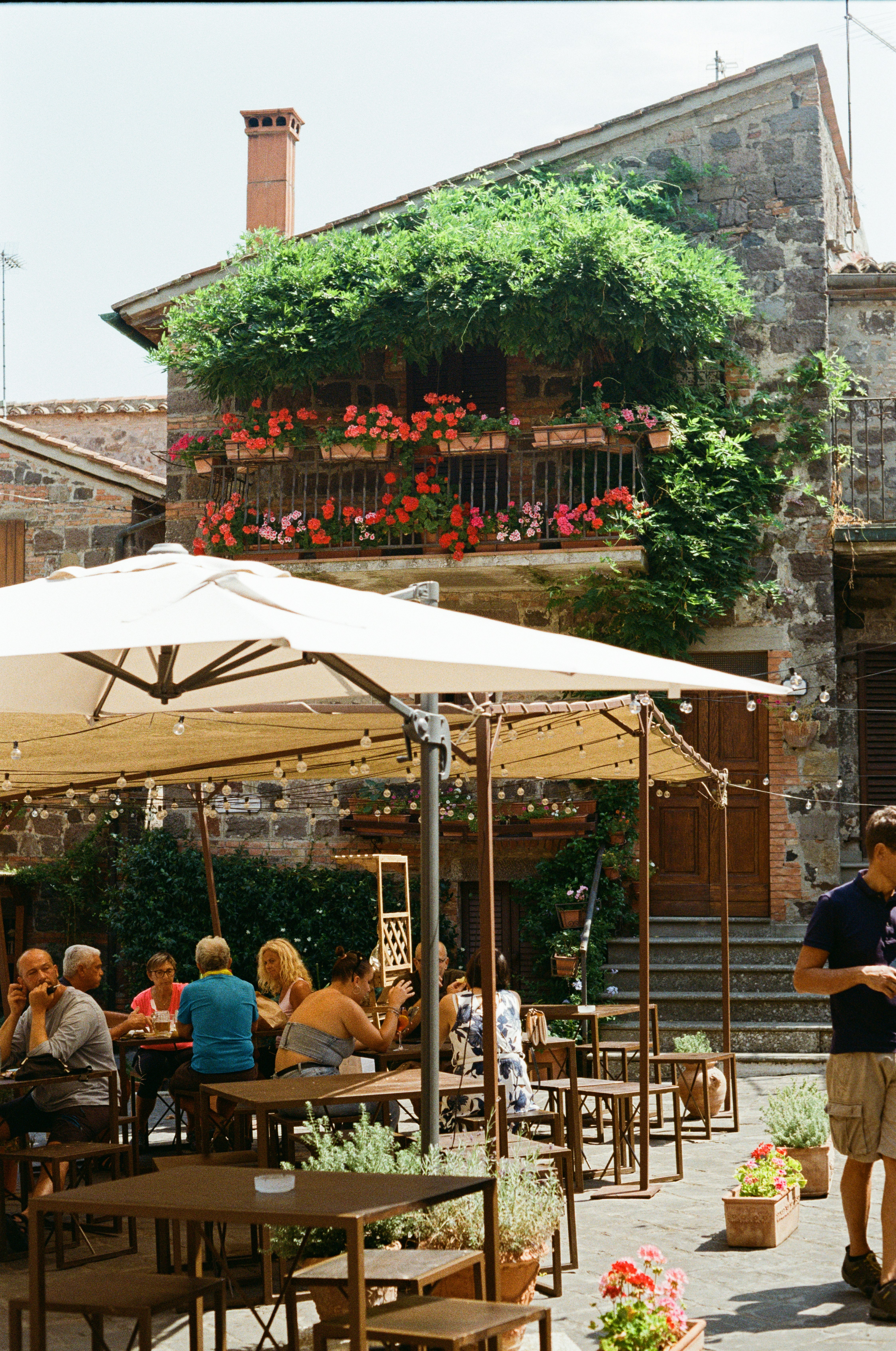 Sunlit Terrace of a Stone Café Oasis