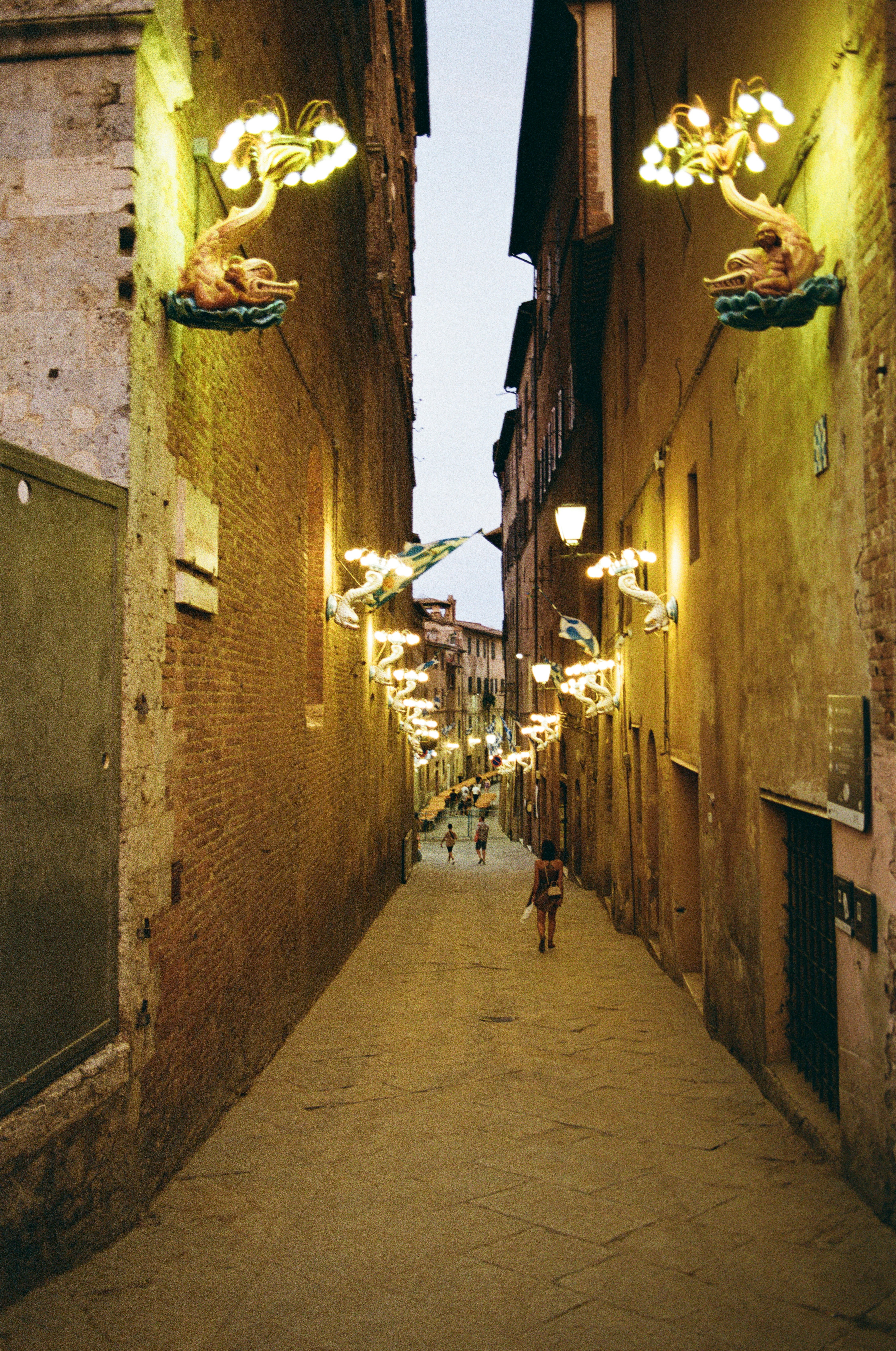 Lantern-lit Alley: A Quiet Descent Toward Distant Figures