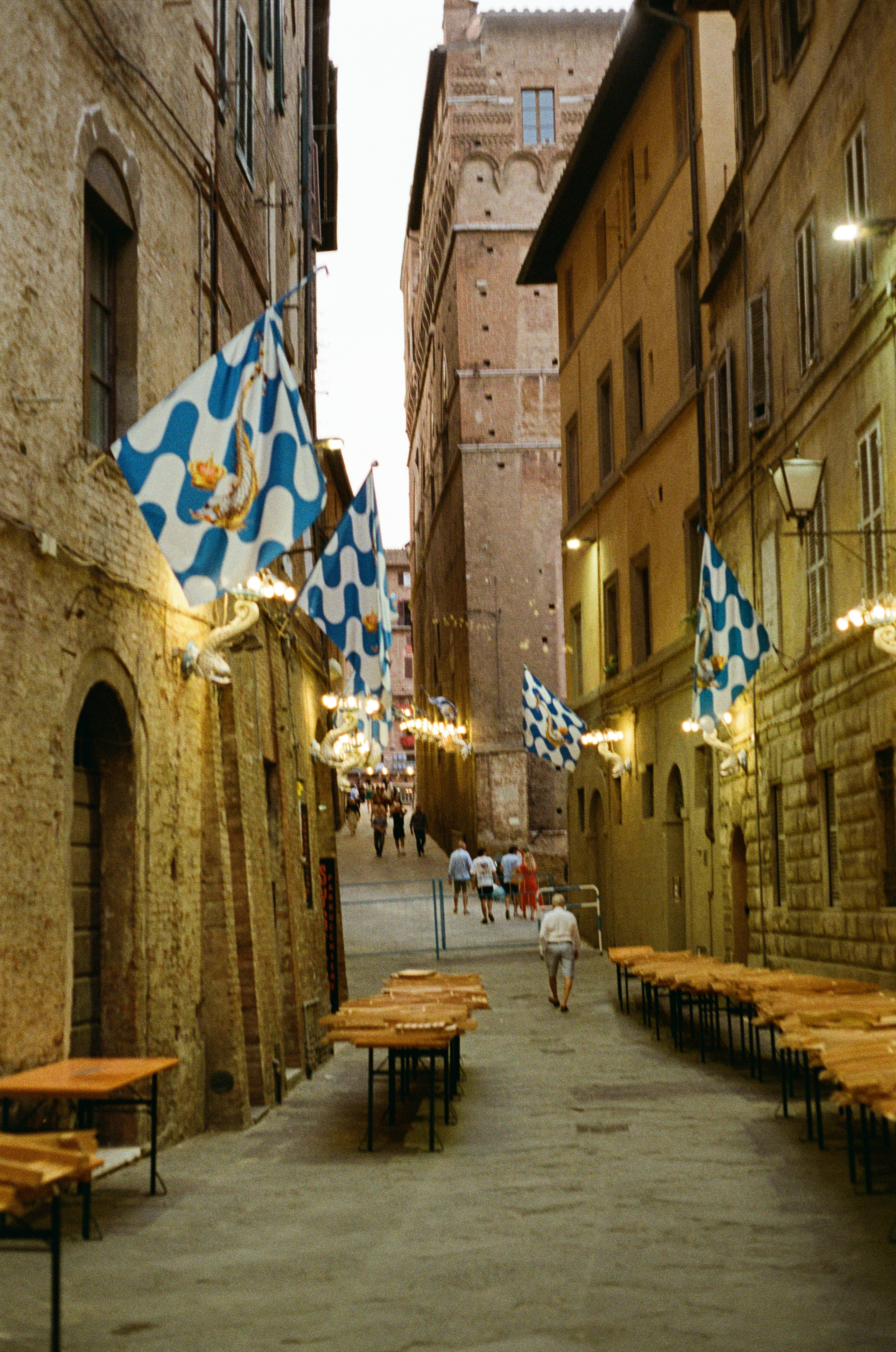 Flagged Alley: Banners, Stone Streets, and Evening Echoes