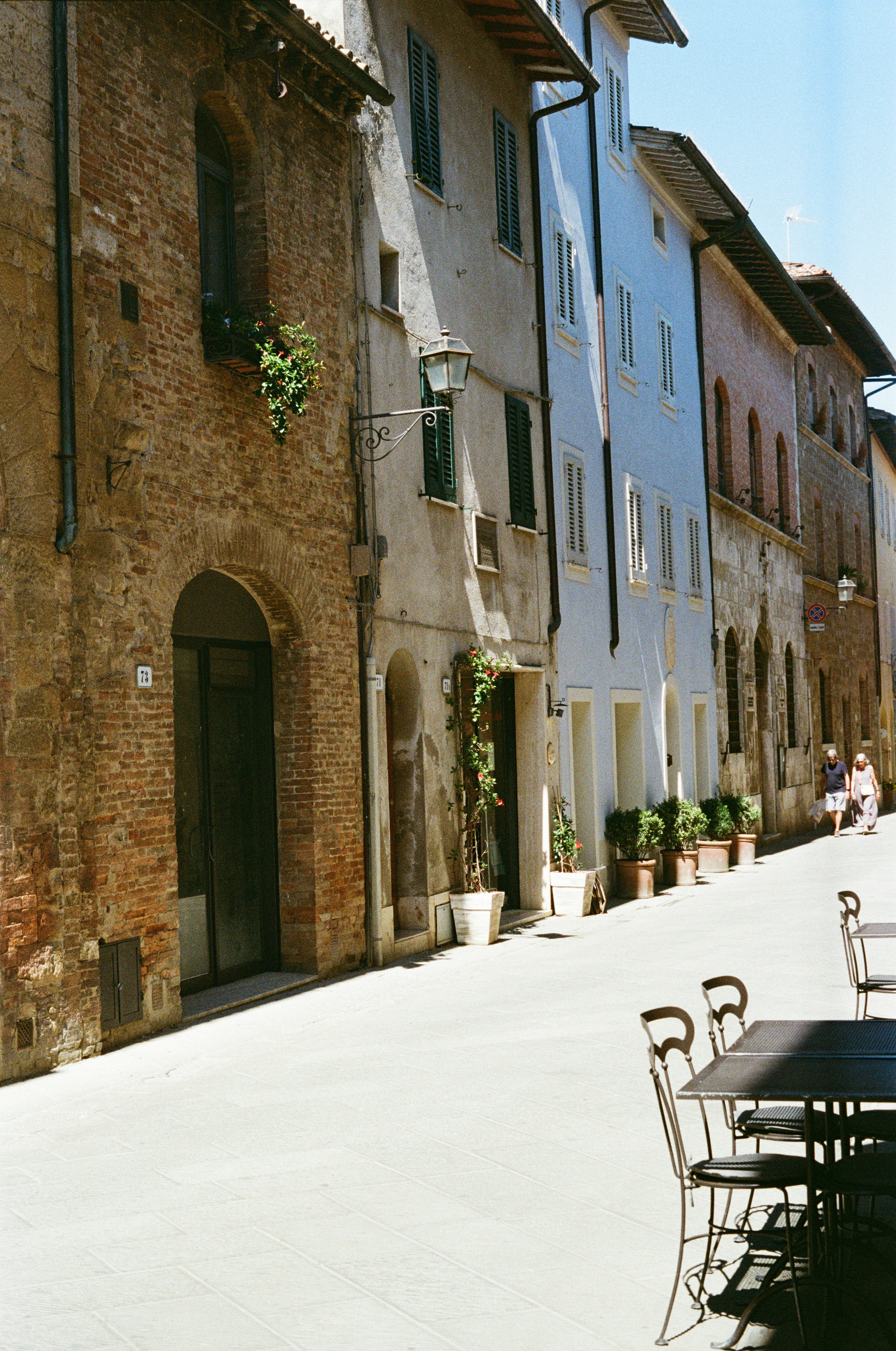 Sunlit Facade Alley: A Quiet Corridor of Colorful Italian Townhouses