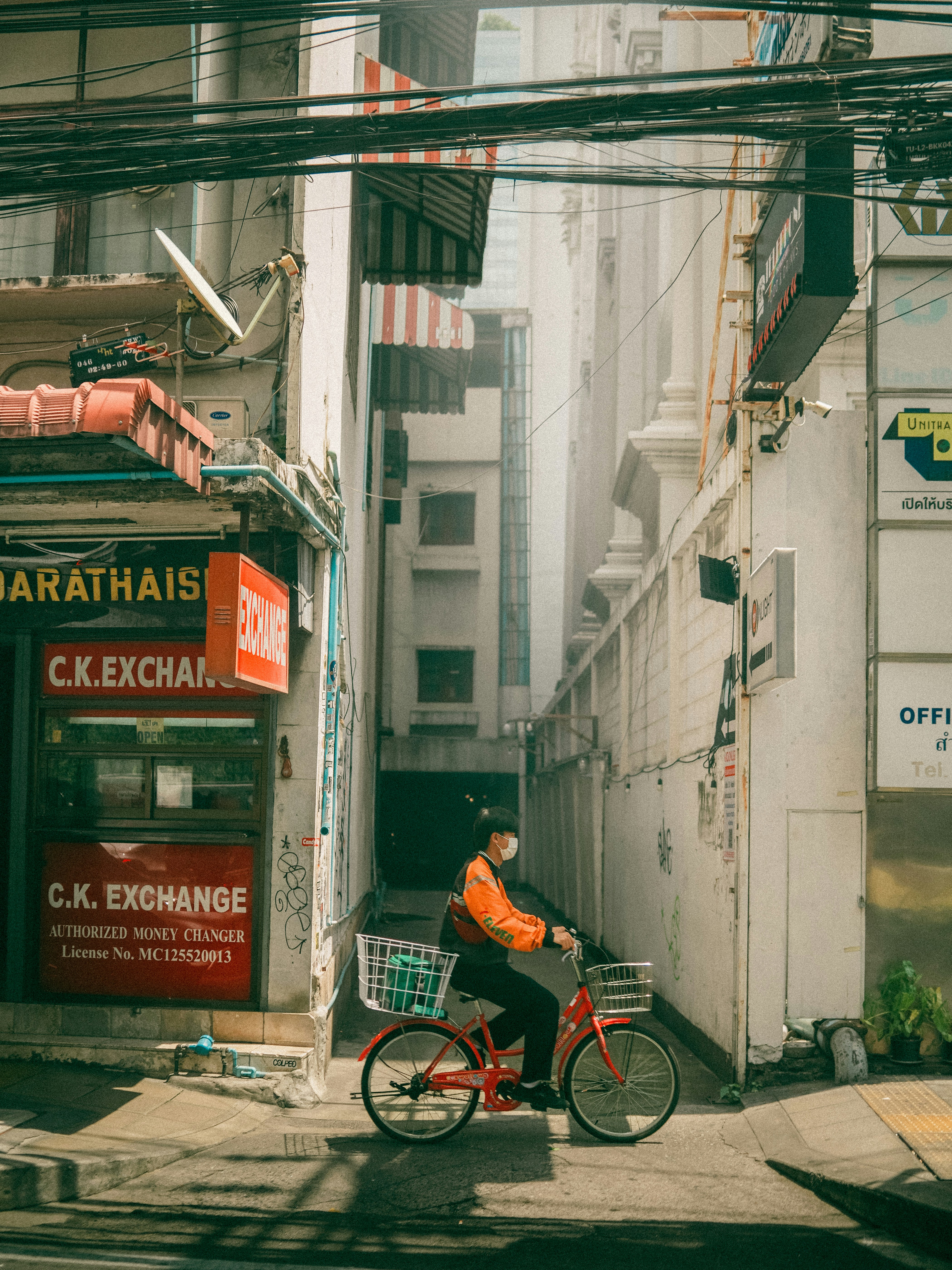 Pedaled Through the Narrow Bangkok Alley