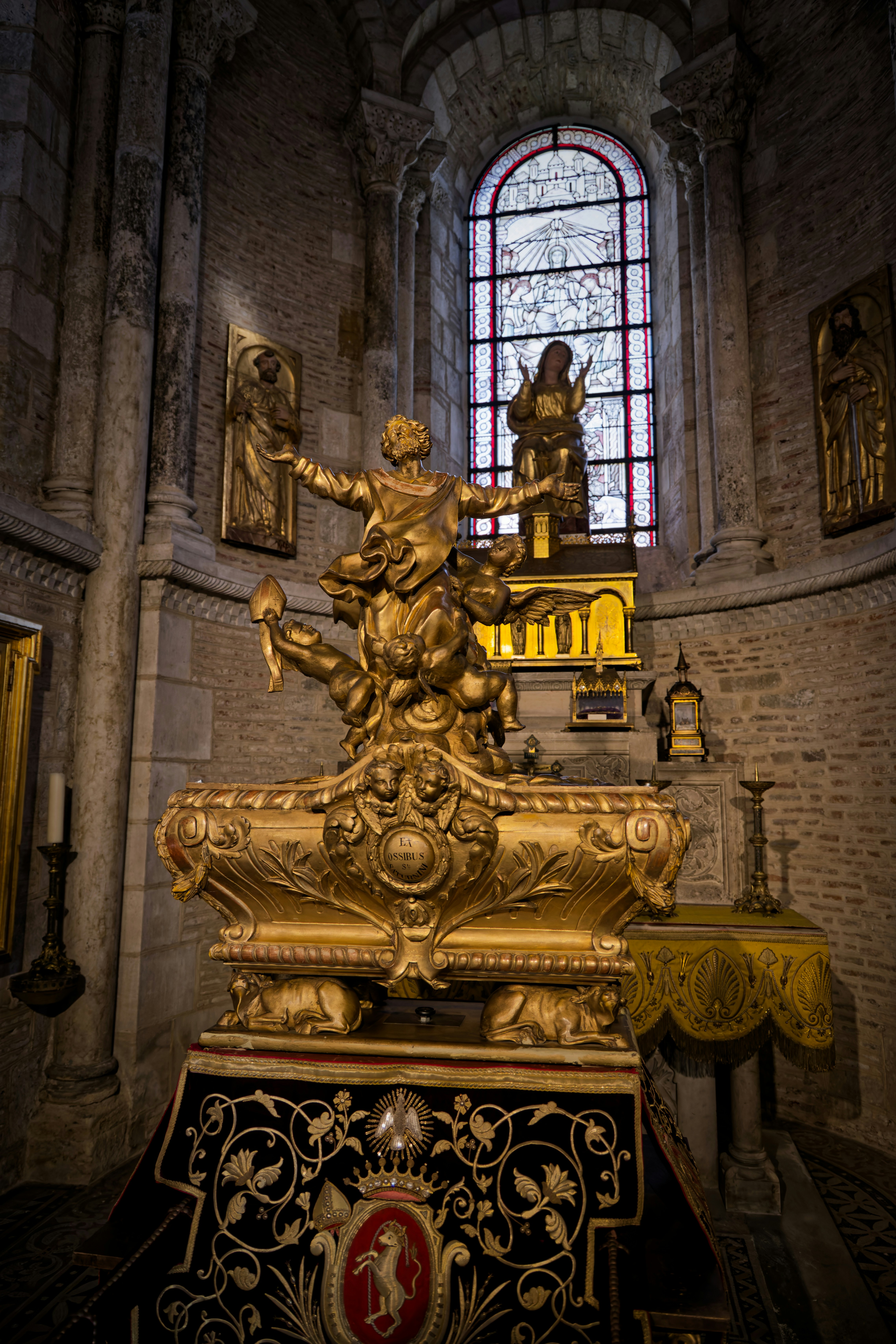Golden Reliquary: A Baroque Statue Illuminated within a Gothic Chapel