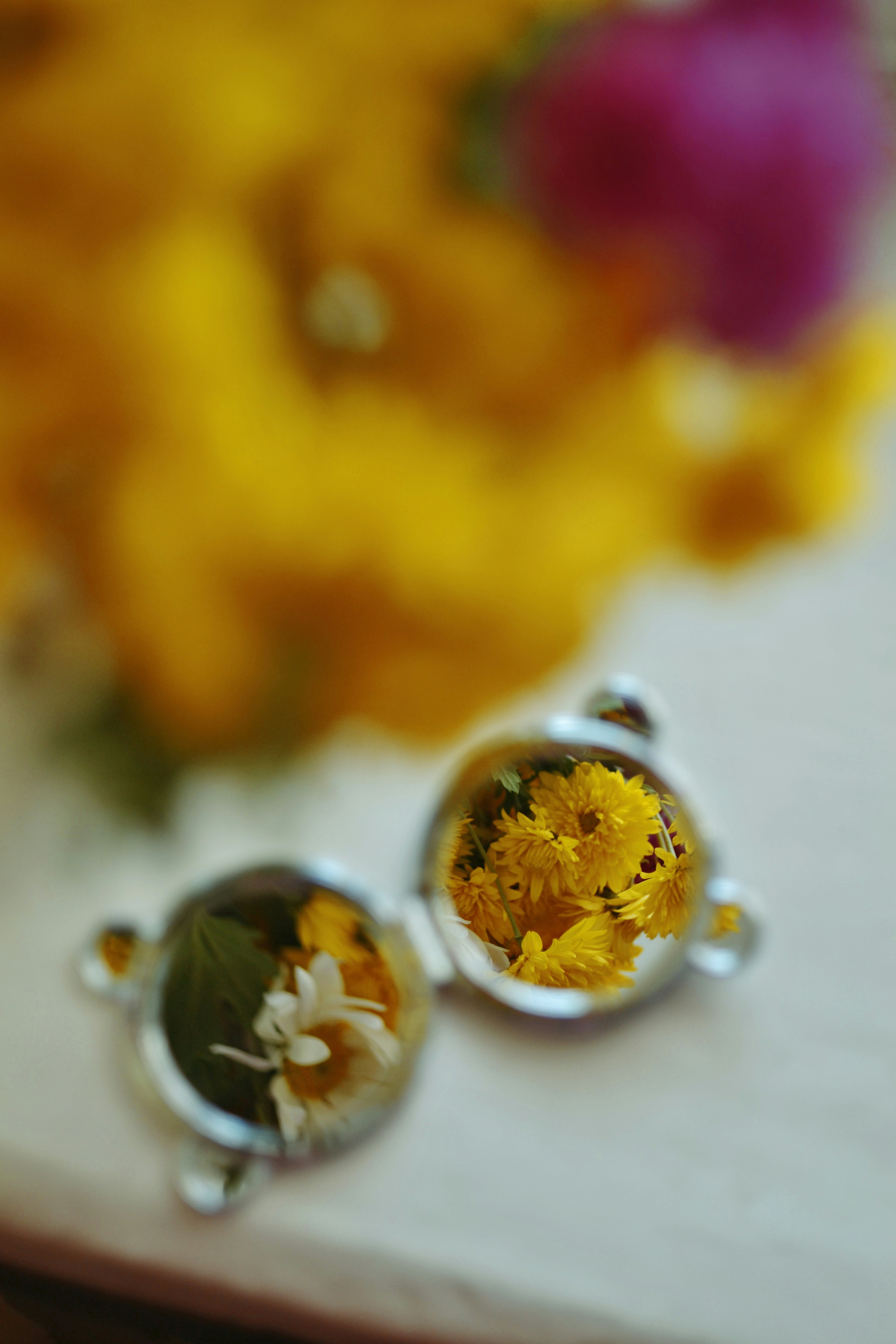 Reflections in Glass: Yellow Florals Framing a Blur