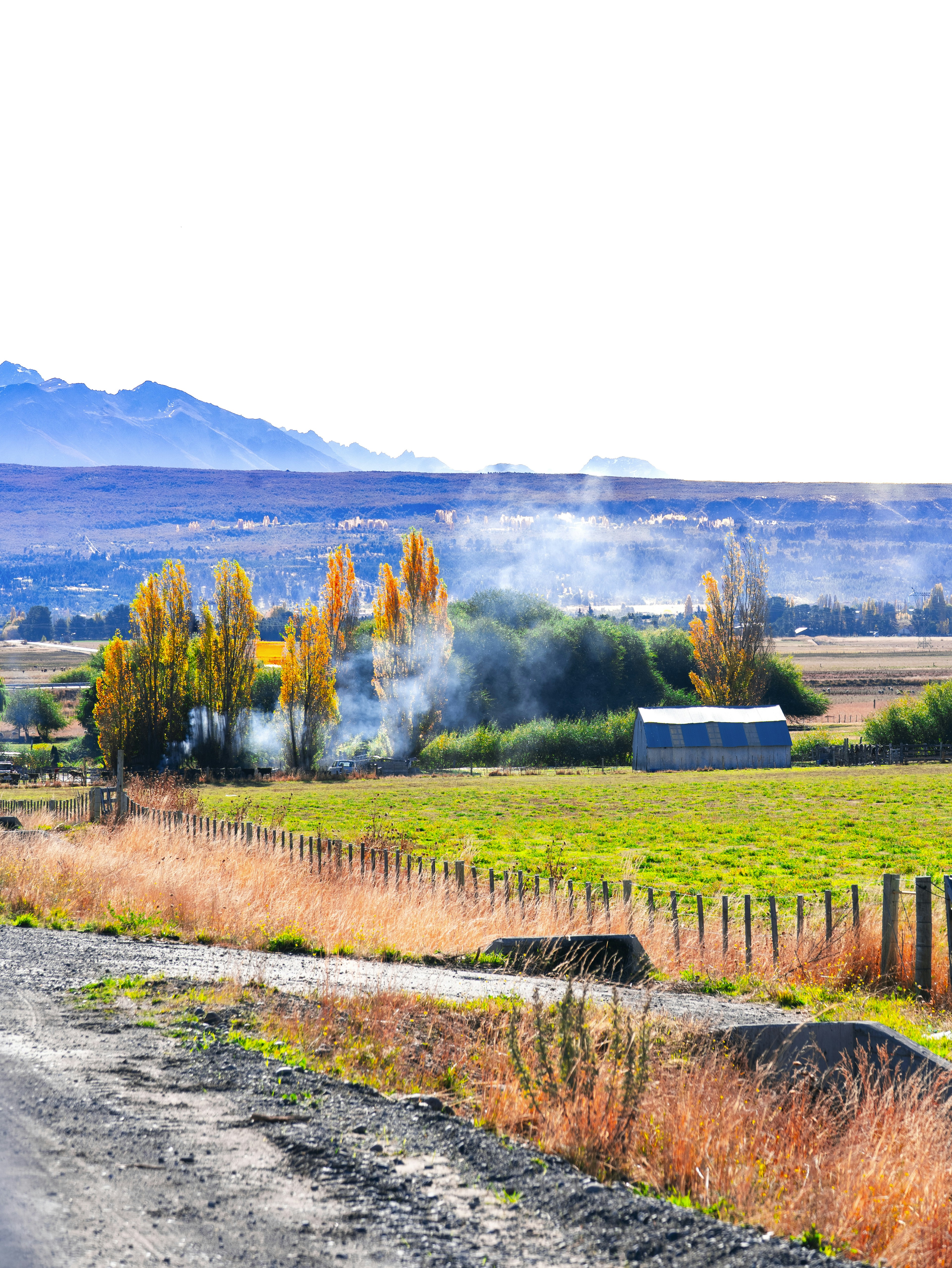 Smoke over the Field: A Quiet Rural Moment