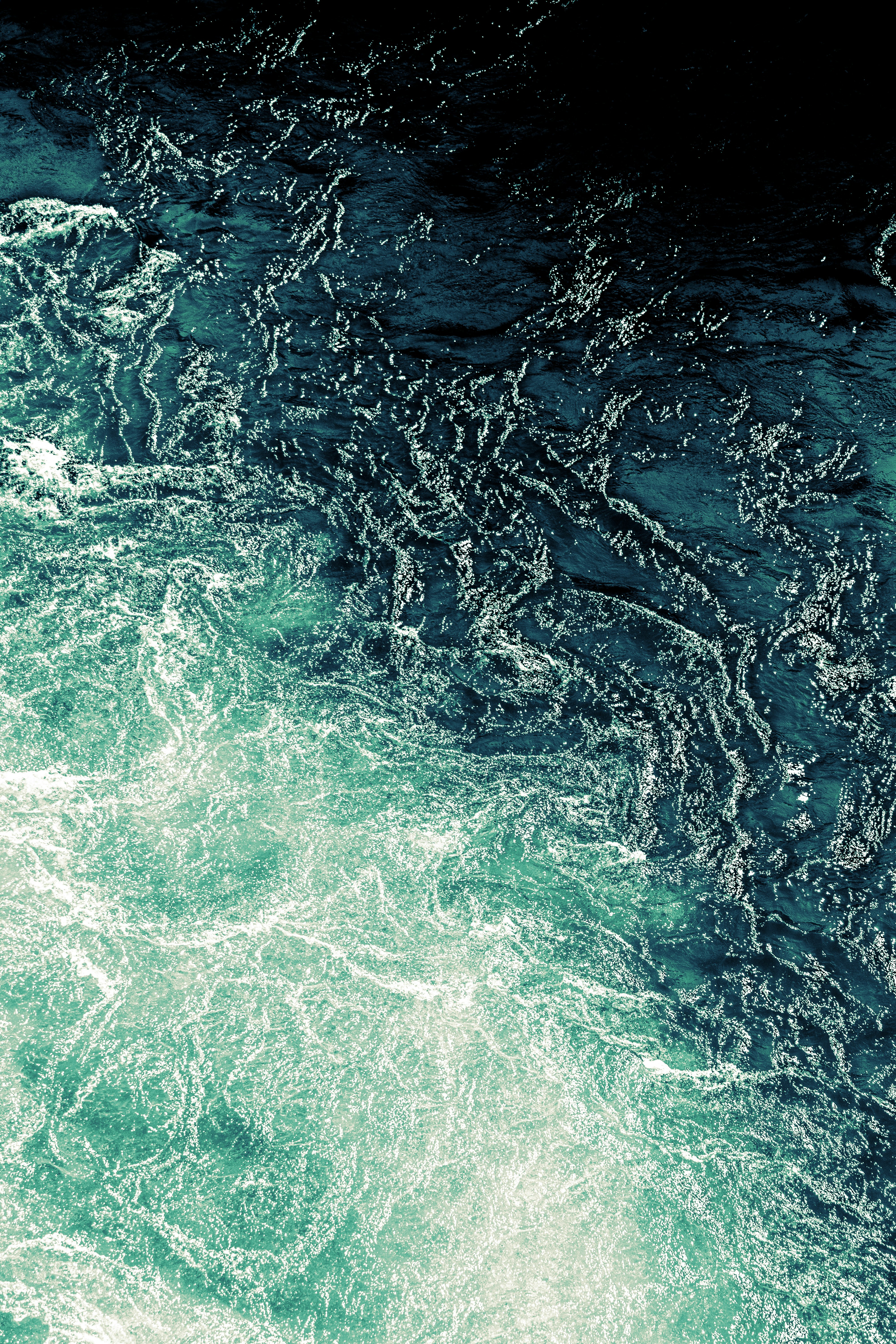 Aerial Pulse: Turquoise Currents and White Foam