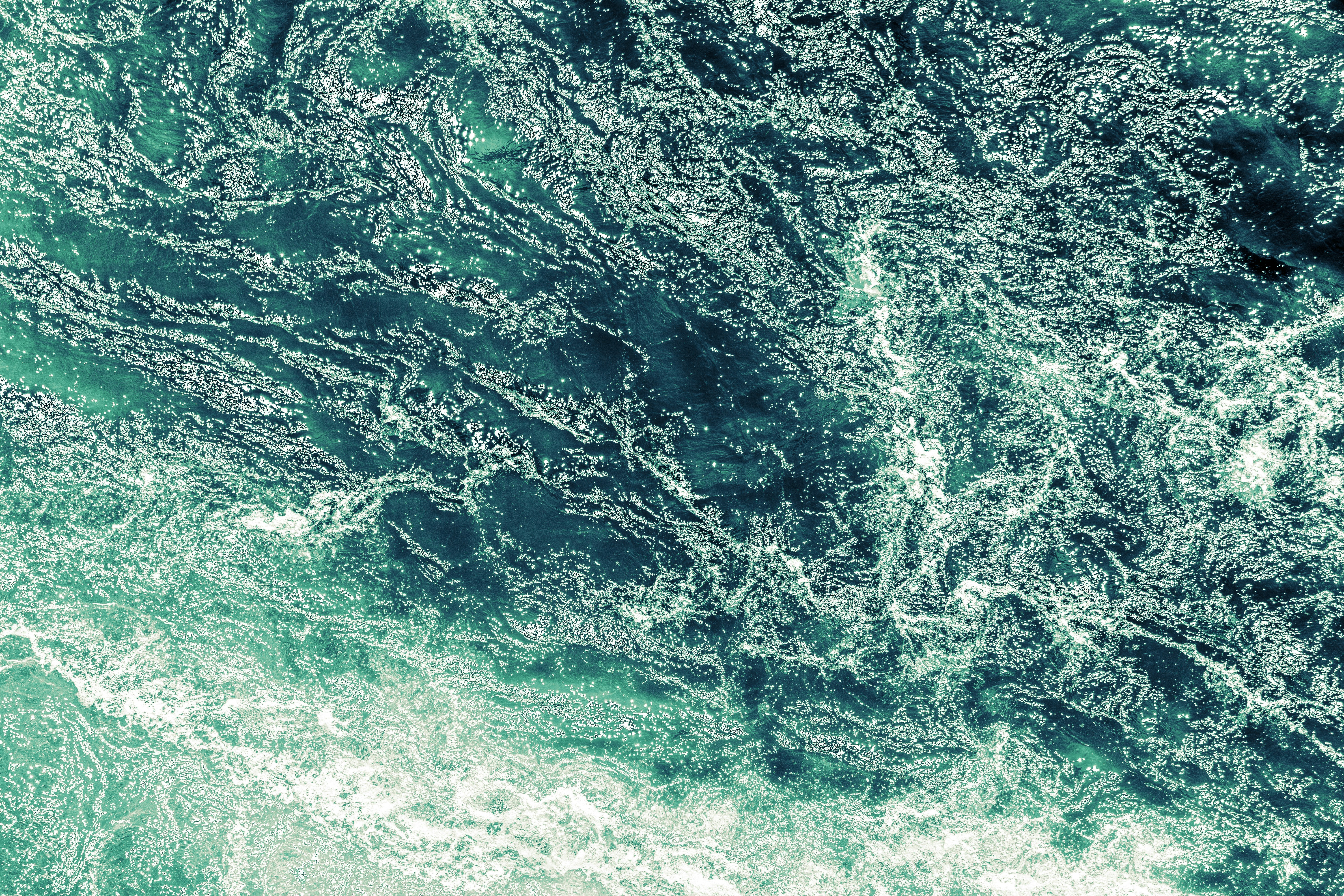 Aerial Pulse: Turquoise Swirl of Ocean Light