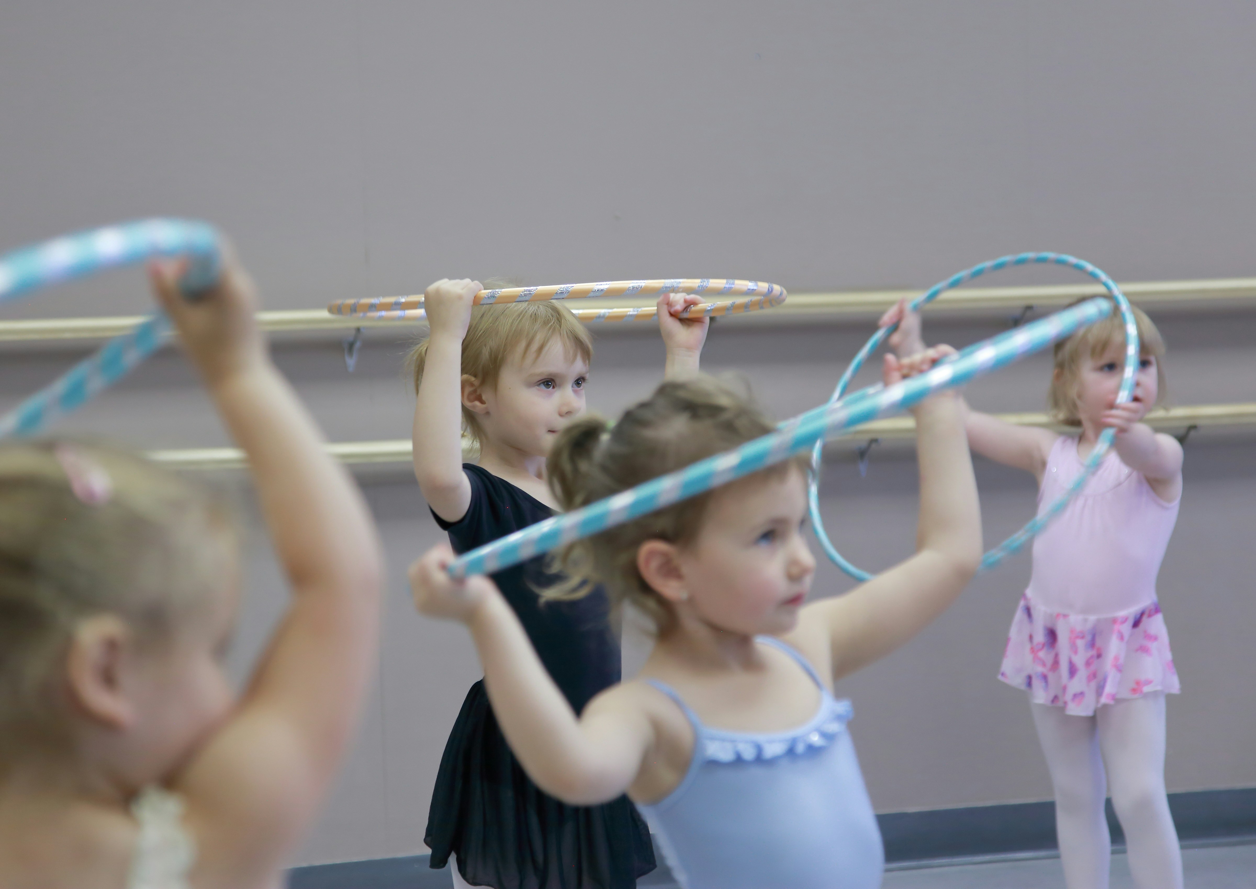 Twirl of ribbons: a shy dancer centers a bright practice