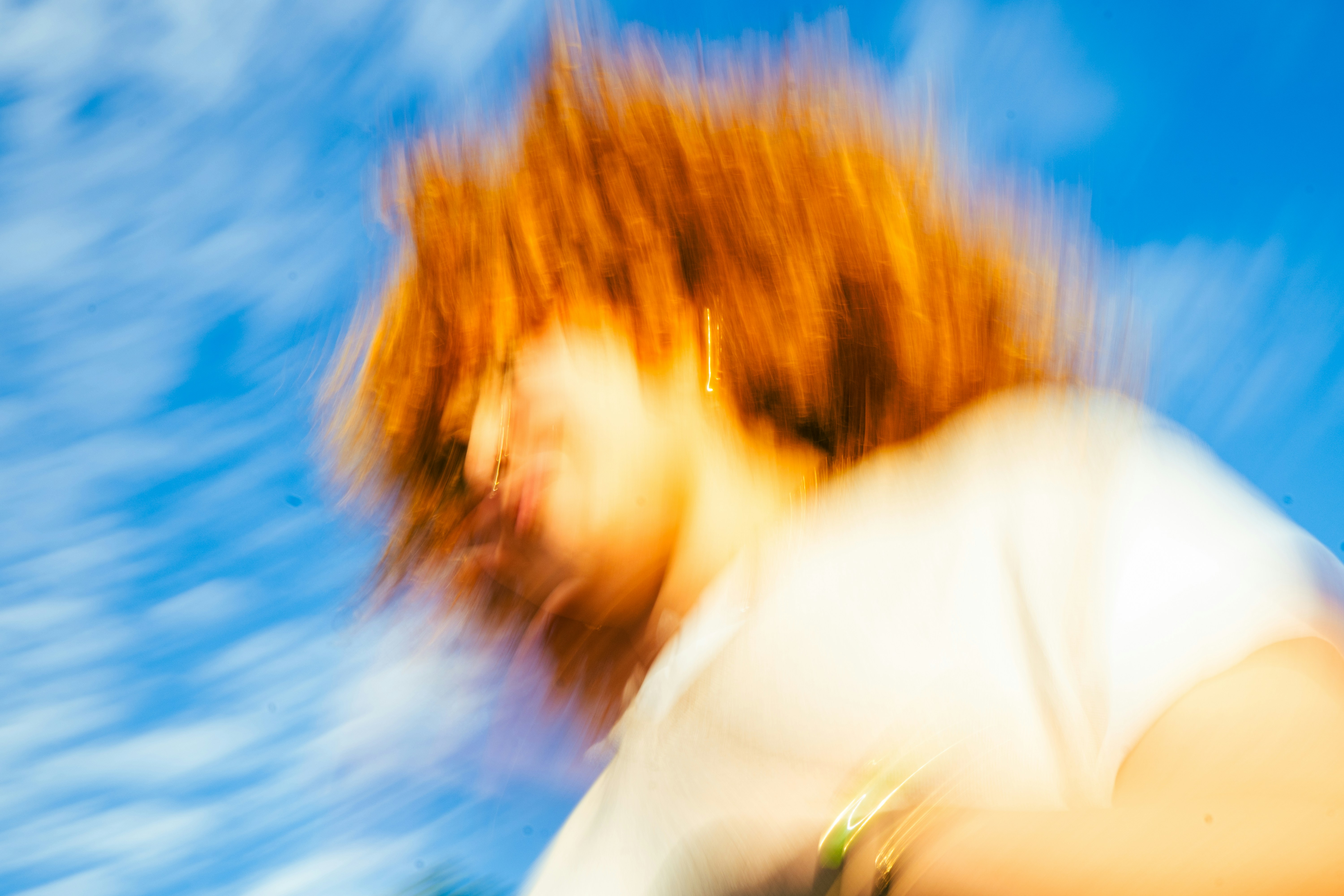 Blurry Portrait Under a Sky of Motion