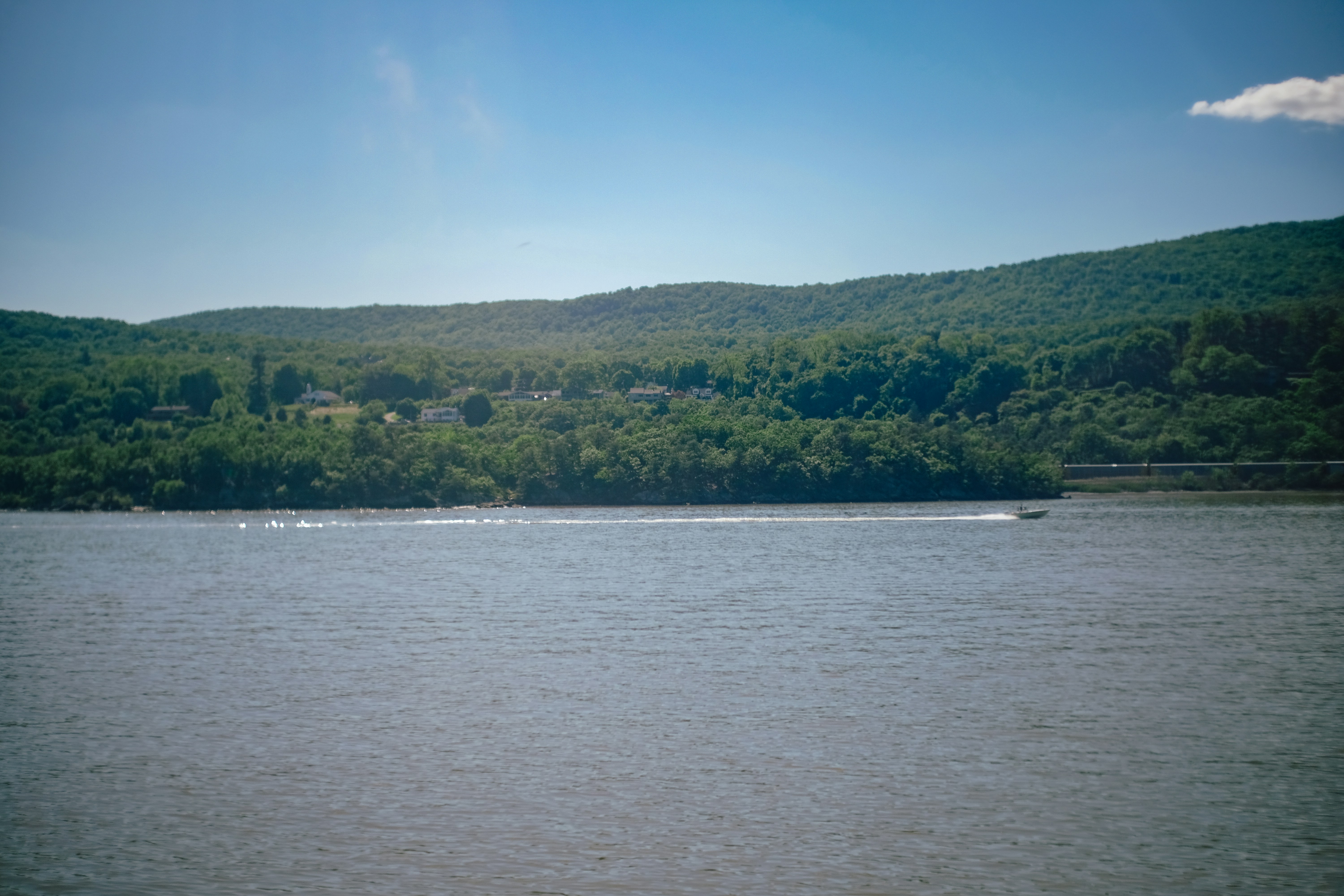 Lakeside Calm: A Quiet Riverside Band Along the Hills