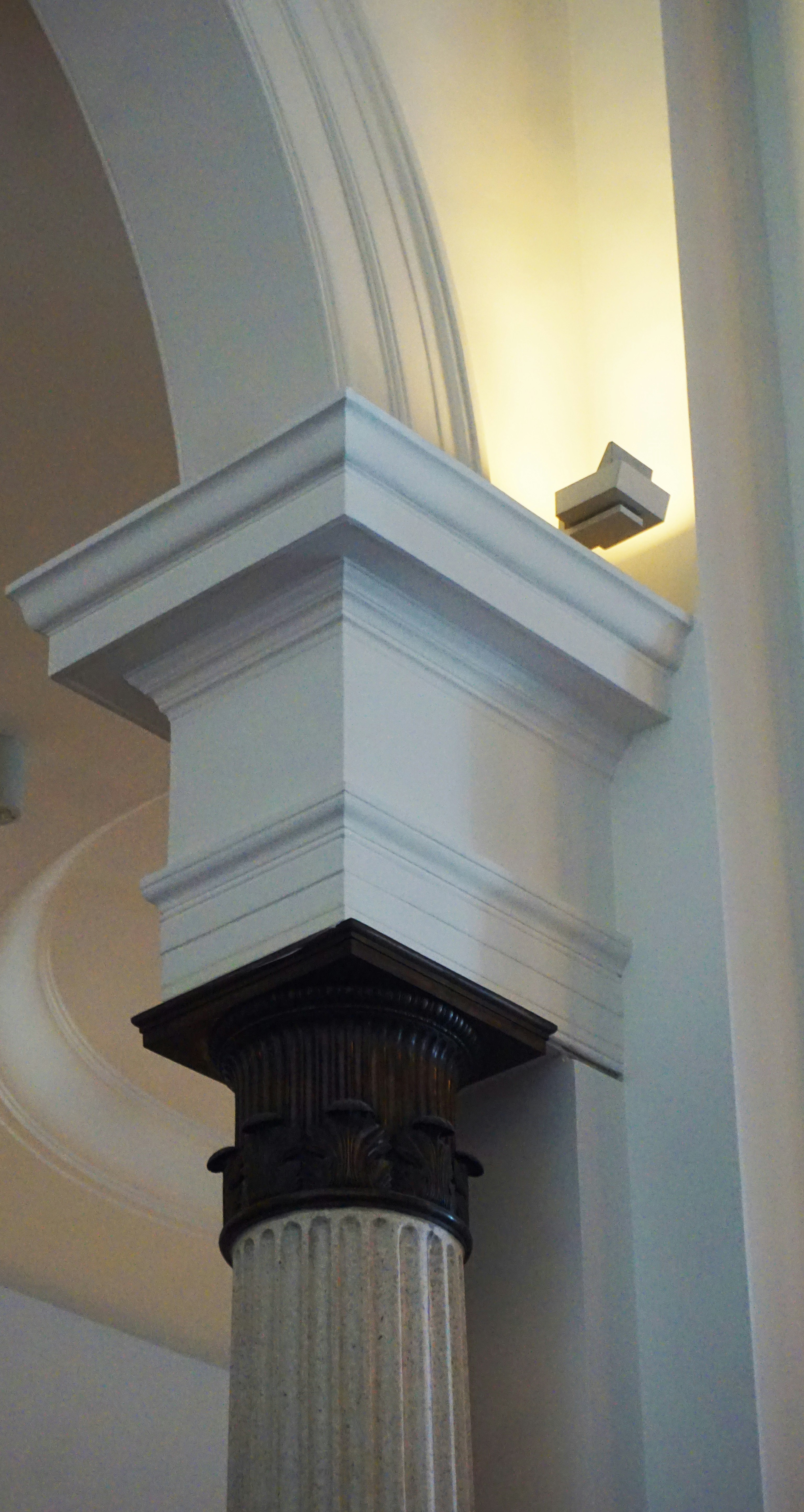 Architectural Column Crest: A Quiet Corner of Light and Steel