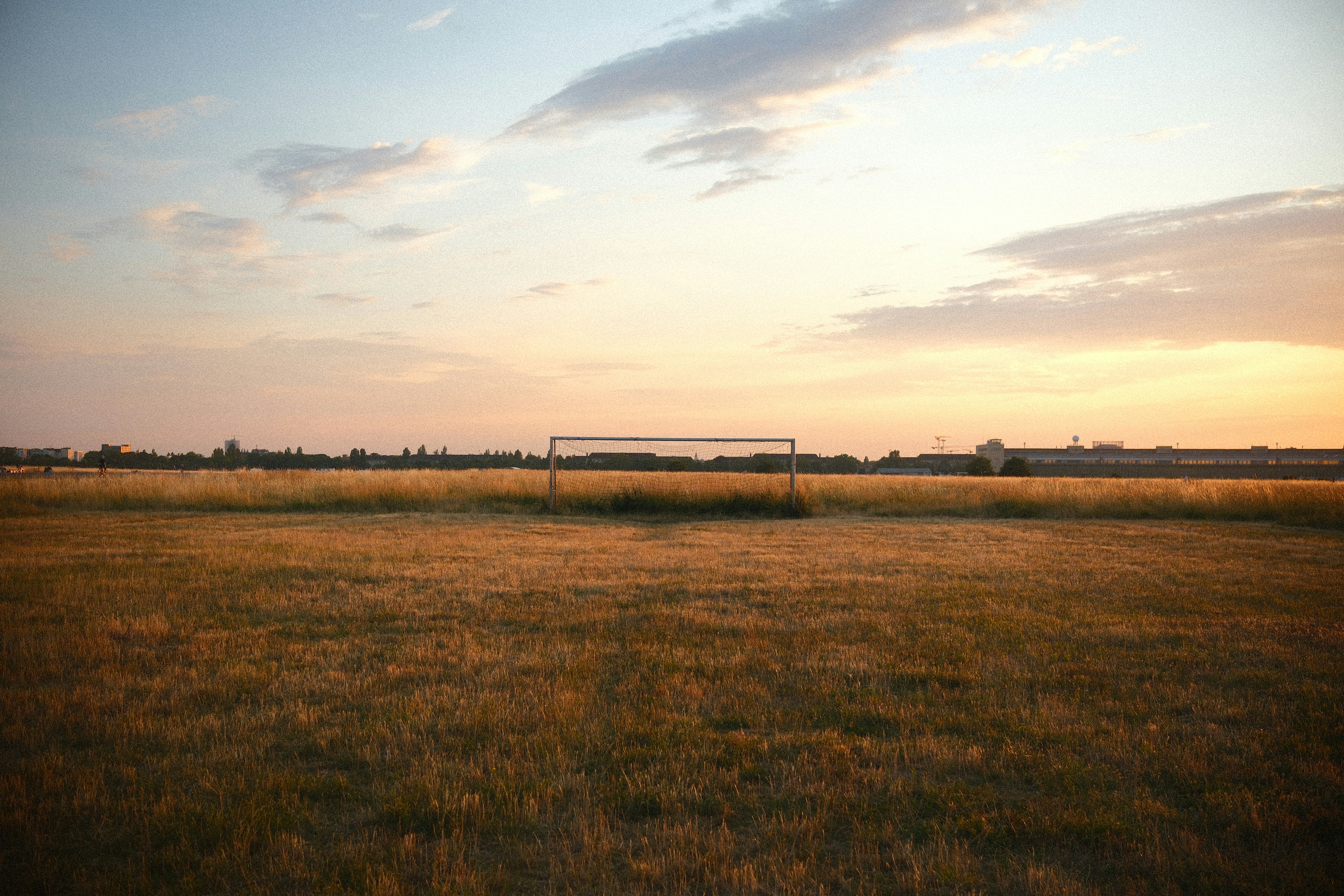 Goalposts at Dusk: Quiet Field in the Golden Hour