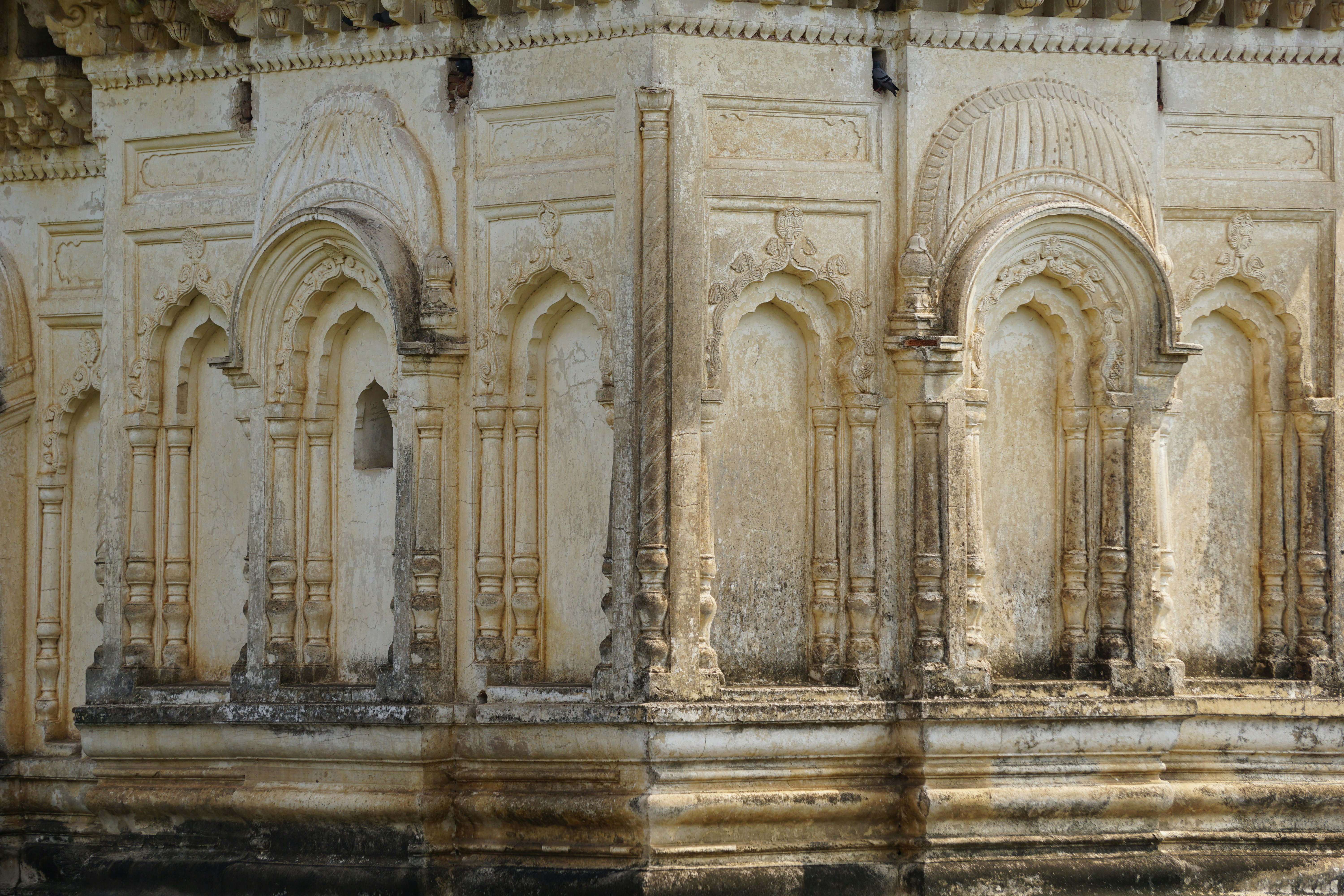 Carved Arches in Time: Weathered Relic Wall