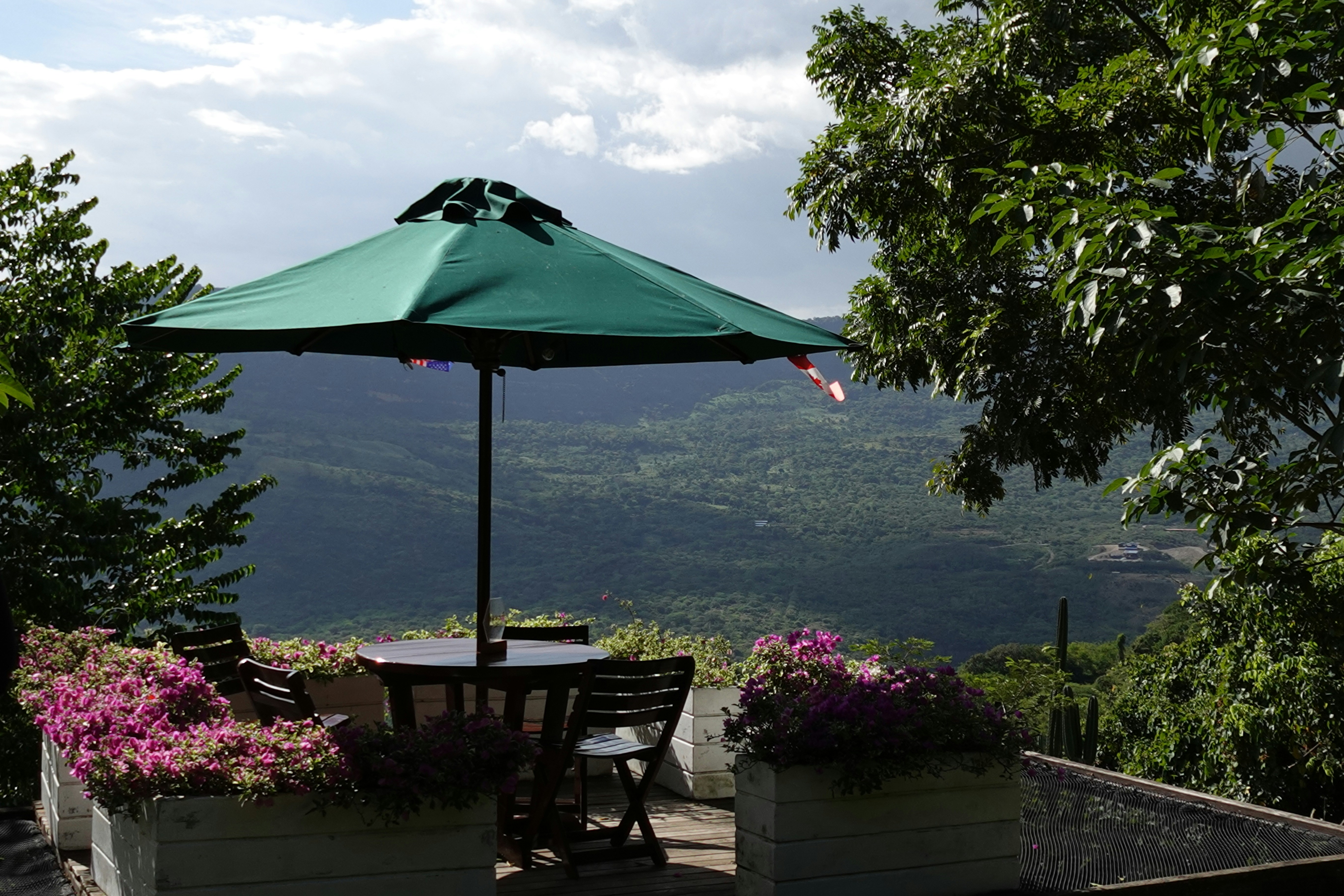 Teal Umbrella Overflowered Terrace with Mountain Vista