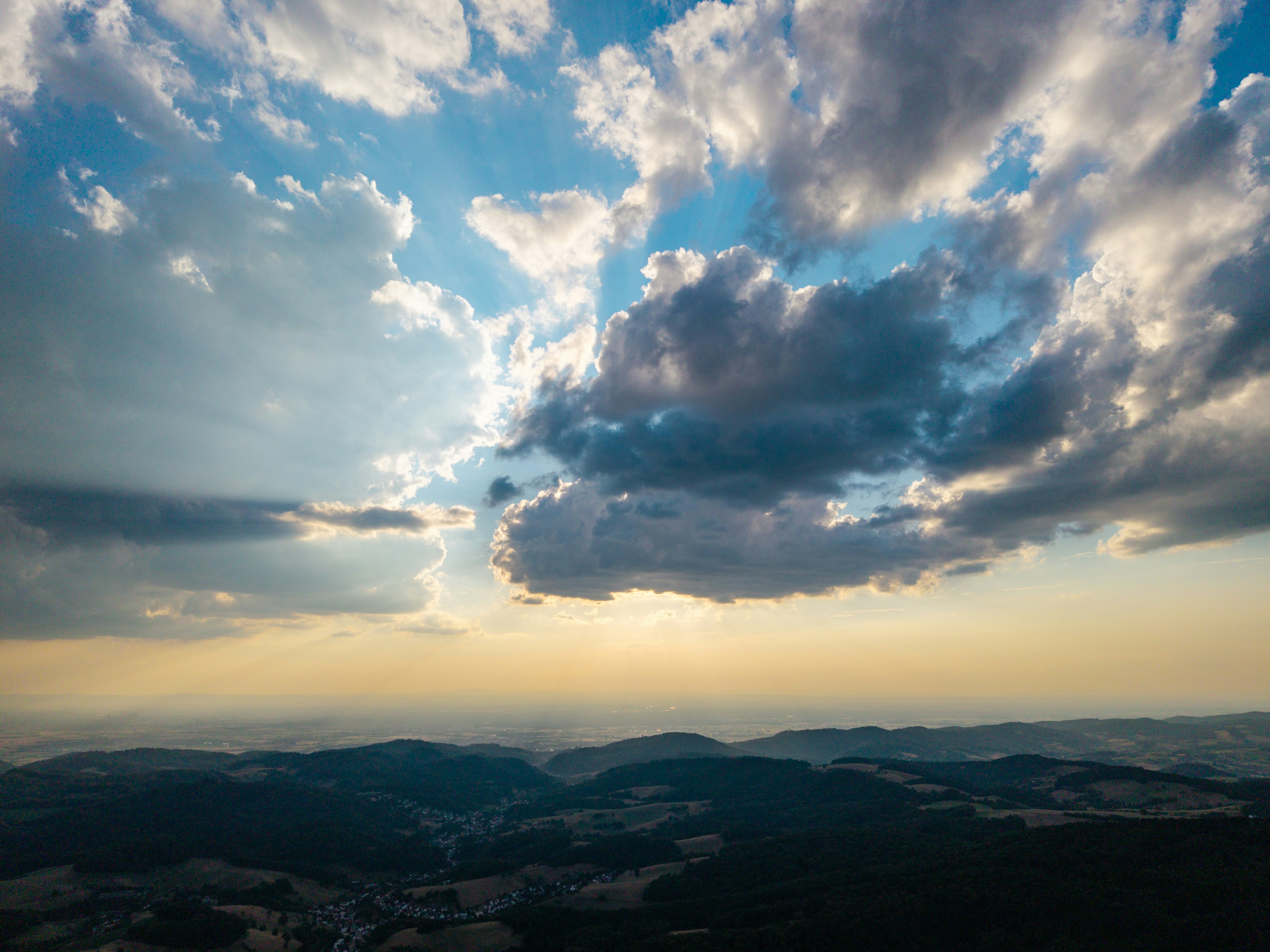 Horizon Light Over Quiet Hills at Sunset
