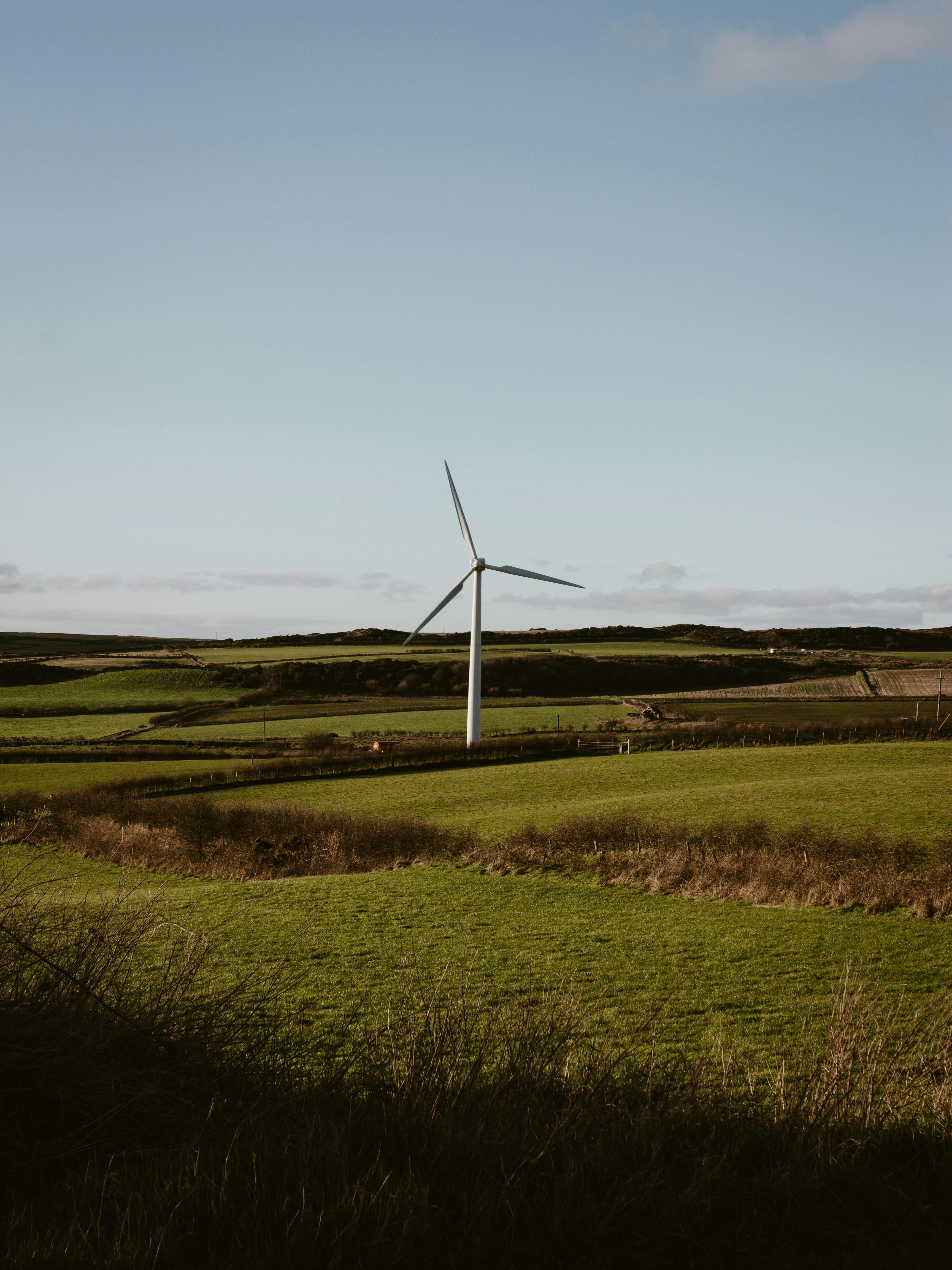 Majestic Wind Turbine over Rolling Farmlands