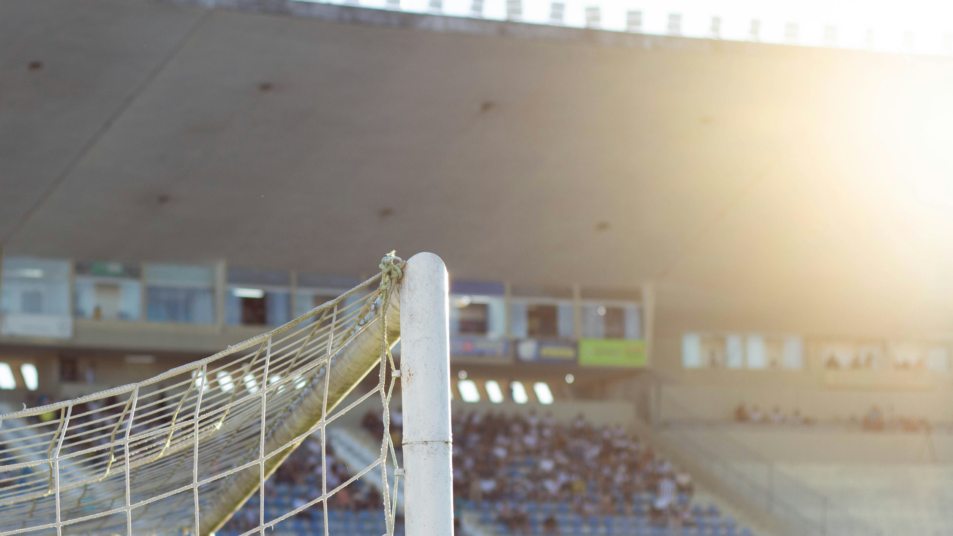 Netting the Goal: A Stadium Vignette in Warm Evening Light