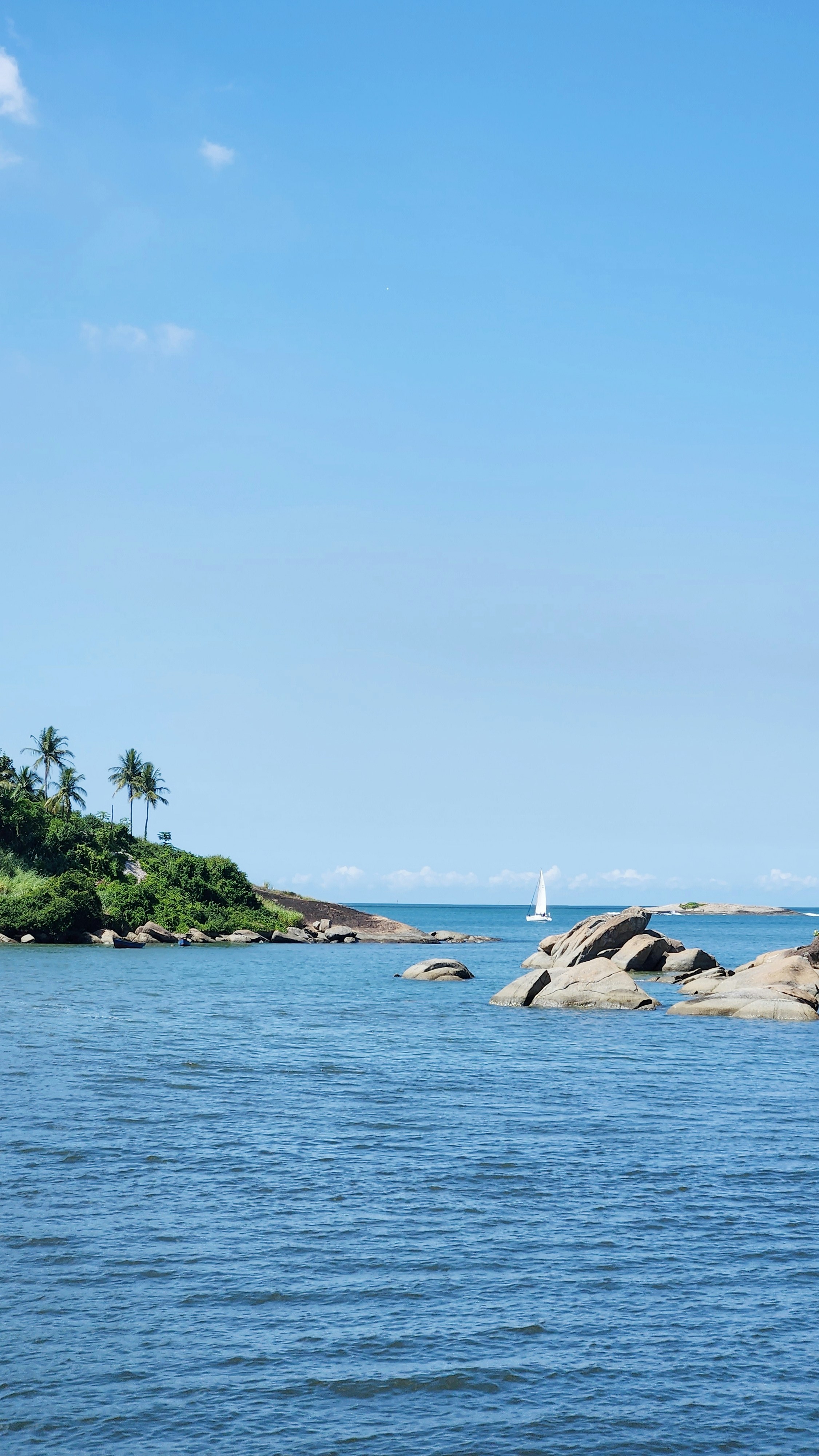 Sail on the Horizon: Quiet Blue Seascape with Lone Vessel