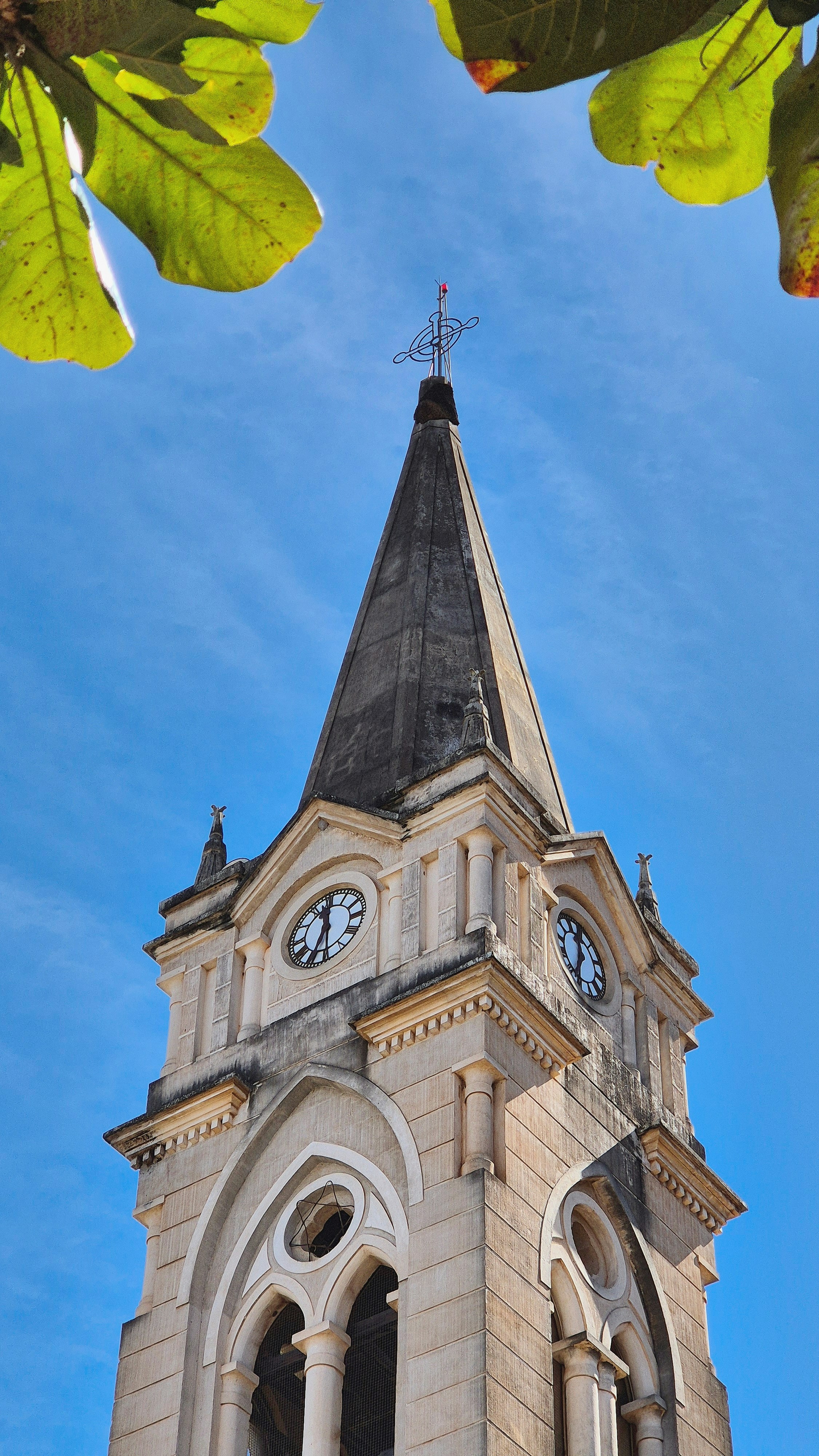 Clocktower Spire Reaching Toward a Bright Blue Sky